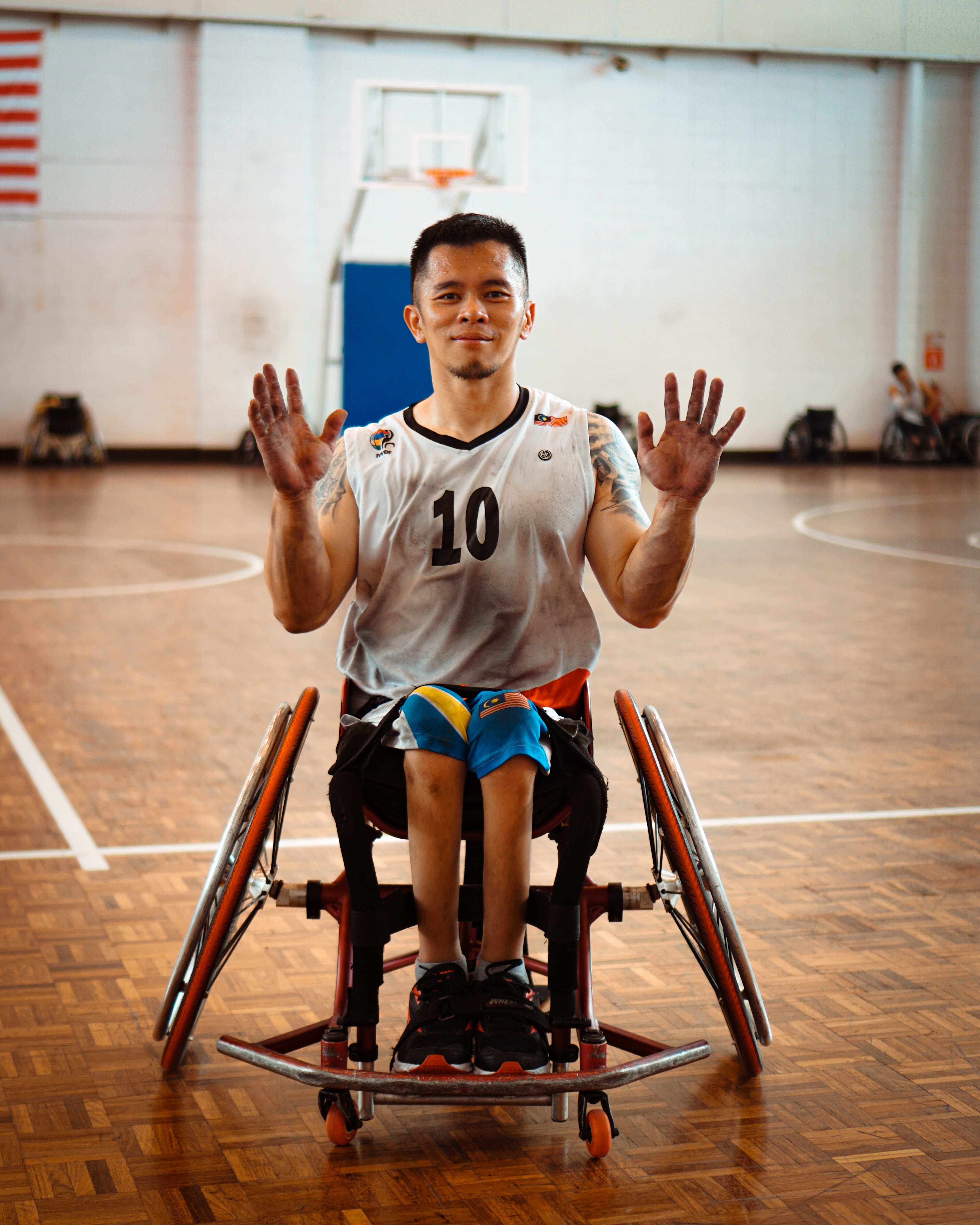 Basketball team stacking hands together · Free Stock Photo
