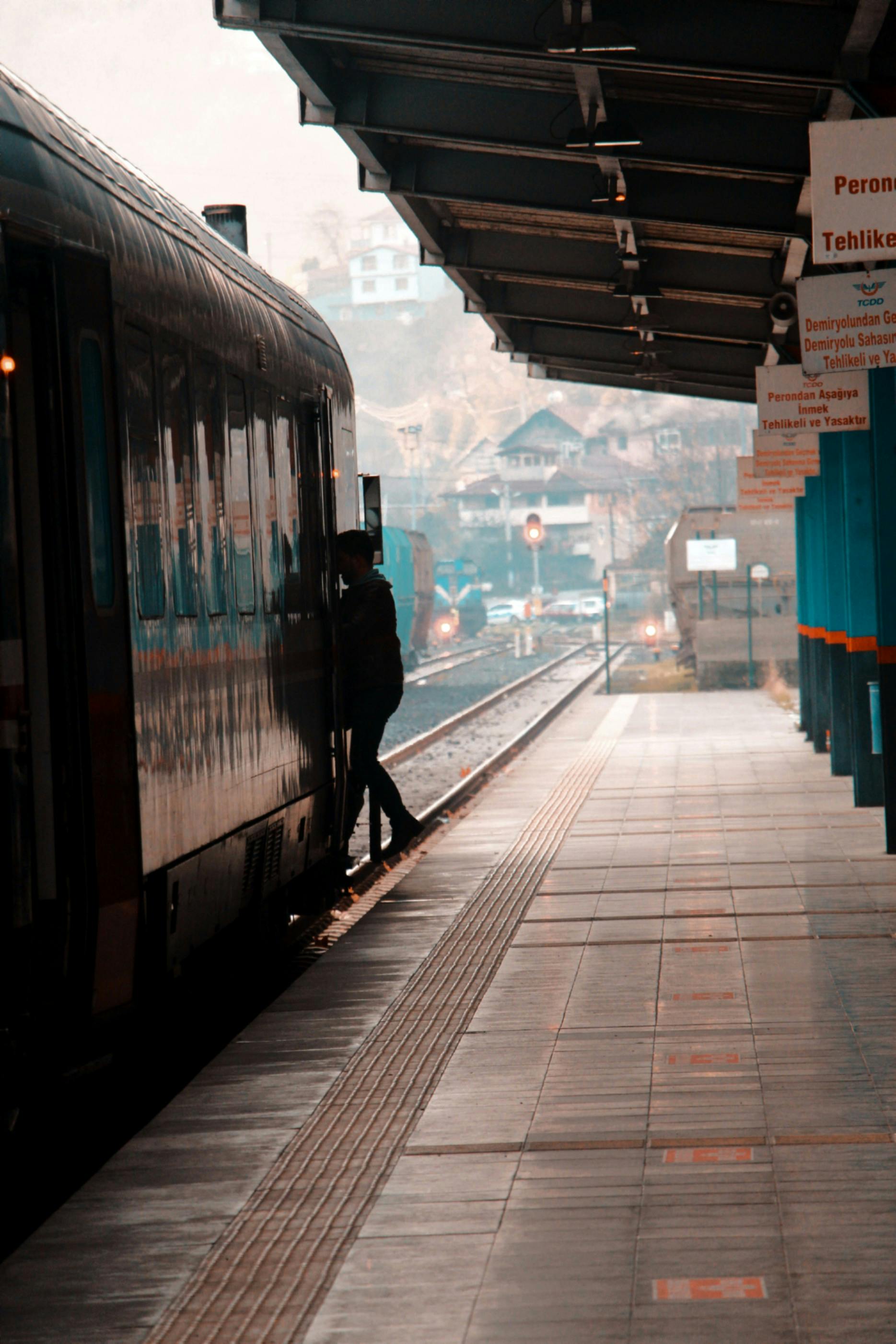 A Passenger Getting inside a Train · Free Stock Photo