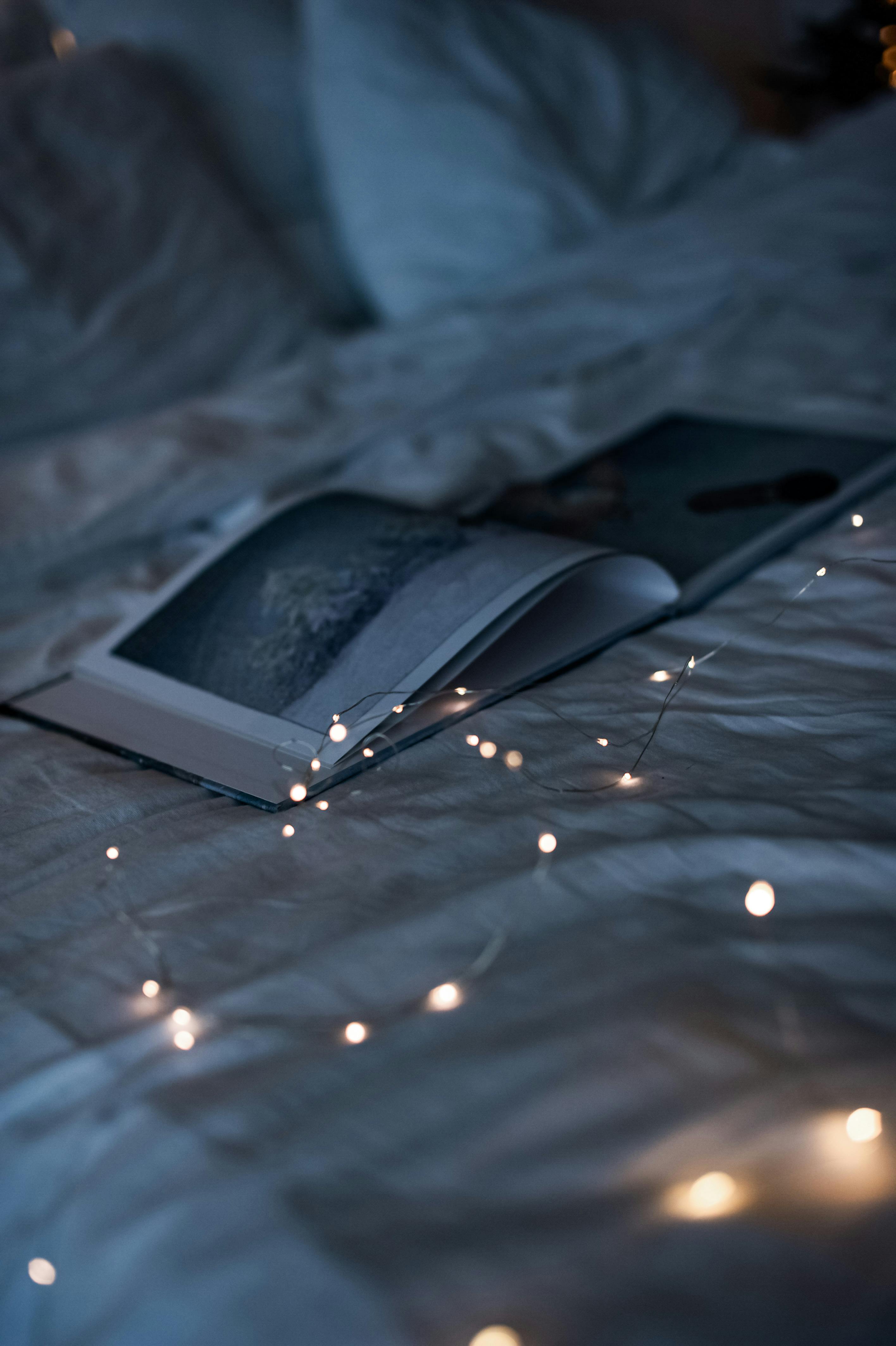 String Lights On Book · Free Stock Photo
