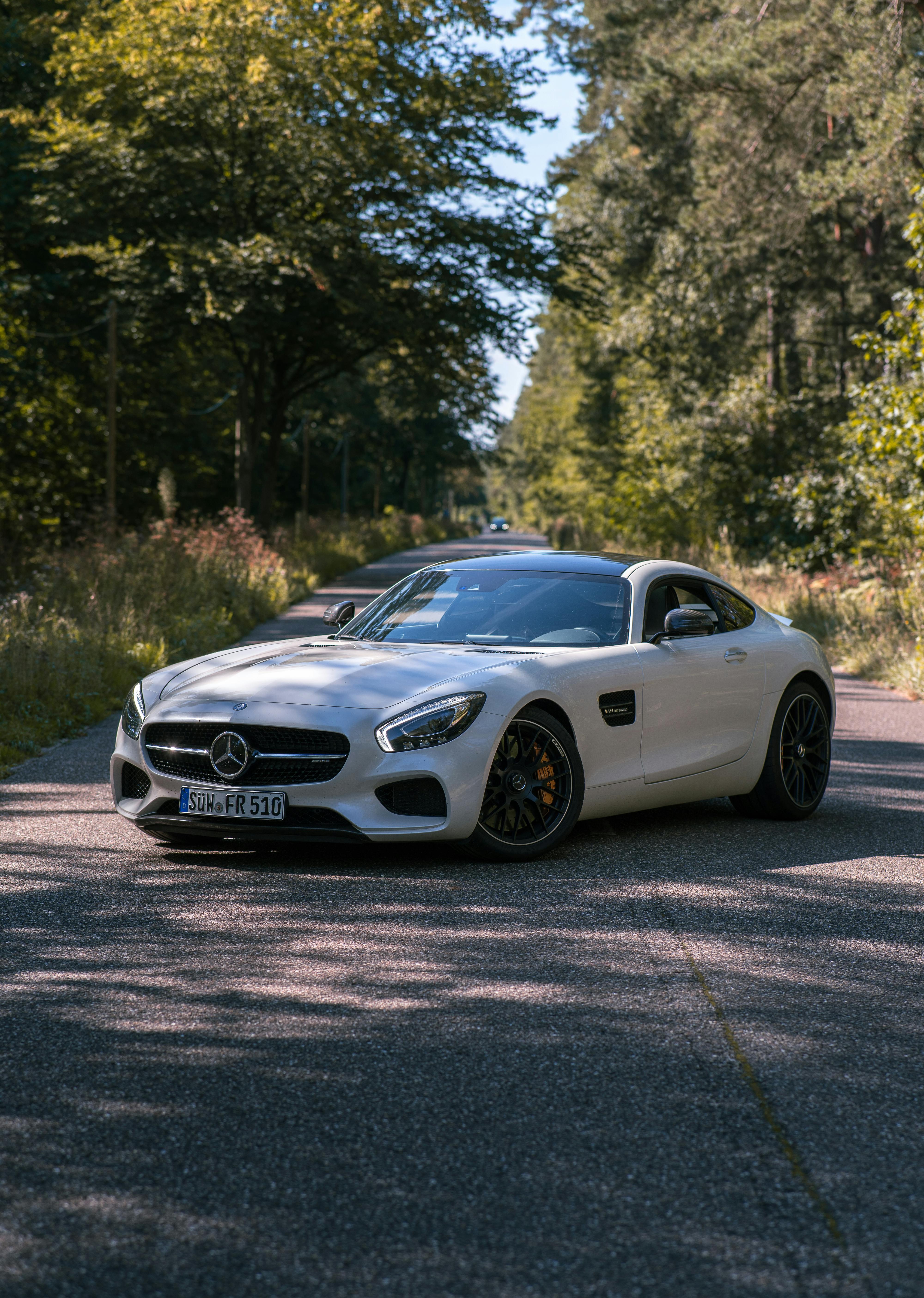 A White Mercedes Benz on the Road · Free Stock Photo