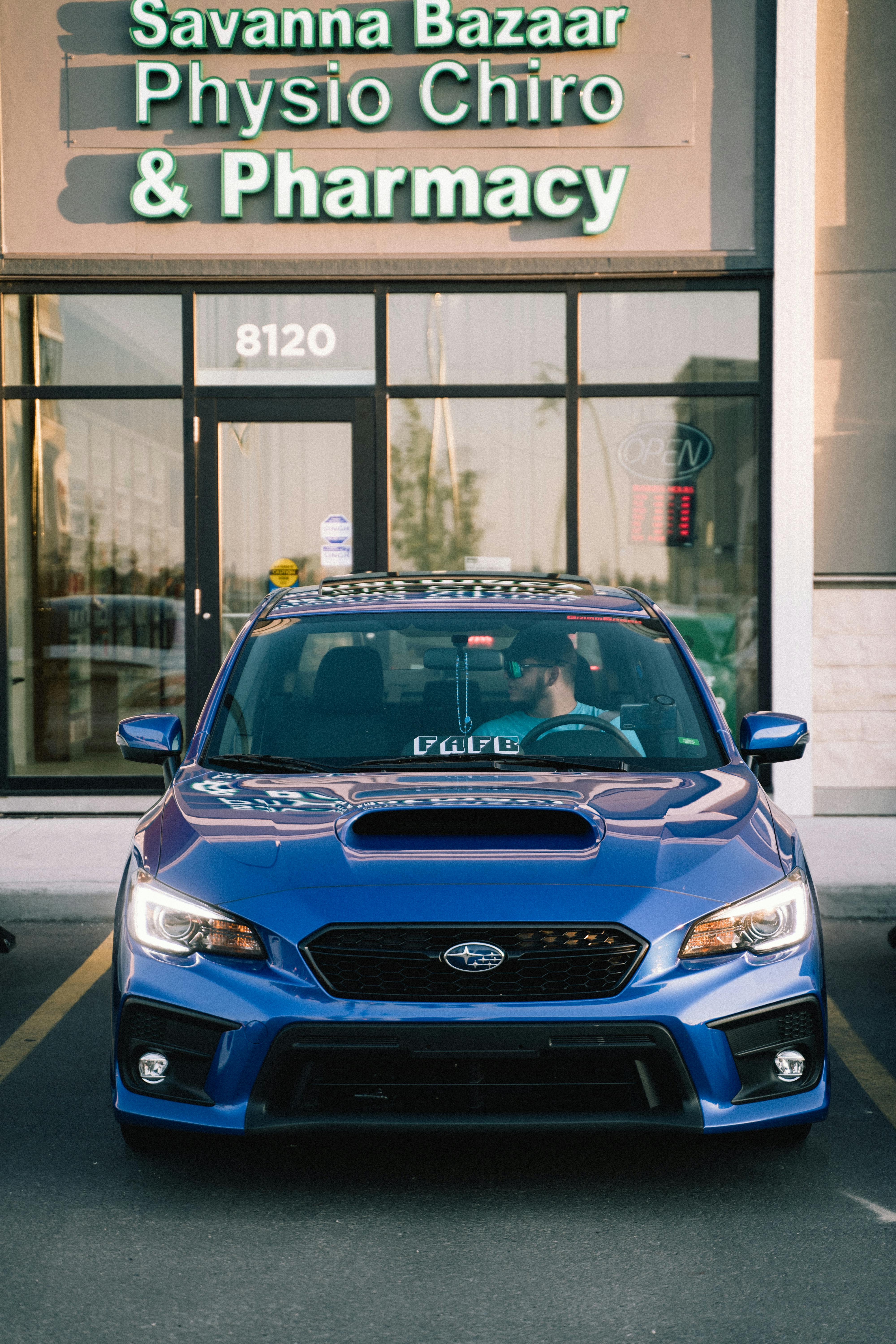 Blue Subaru Car Parked Near the Store · Free Stock Photo