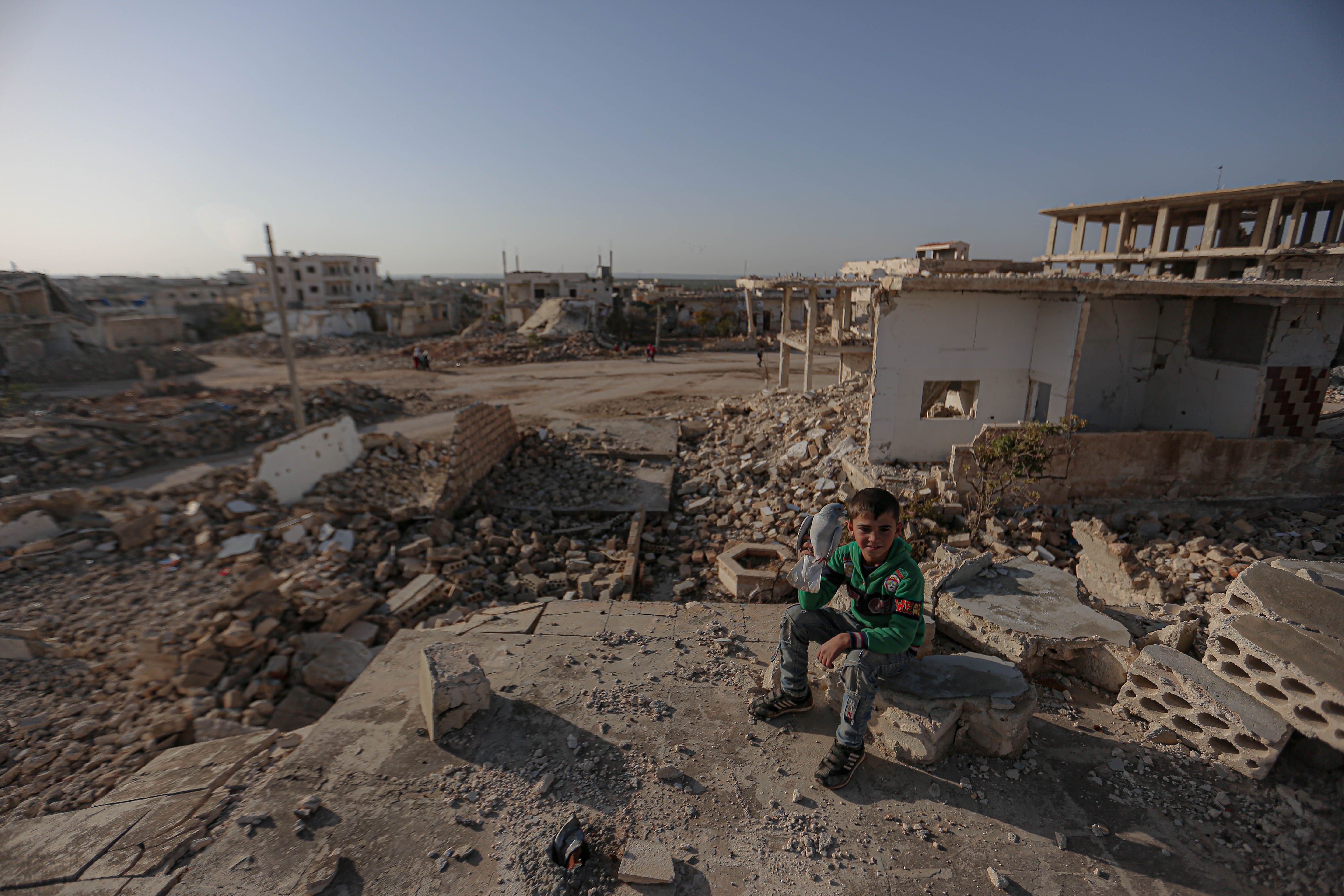 Girl Standing amid Earthquake Rubble · Free Stock Photo