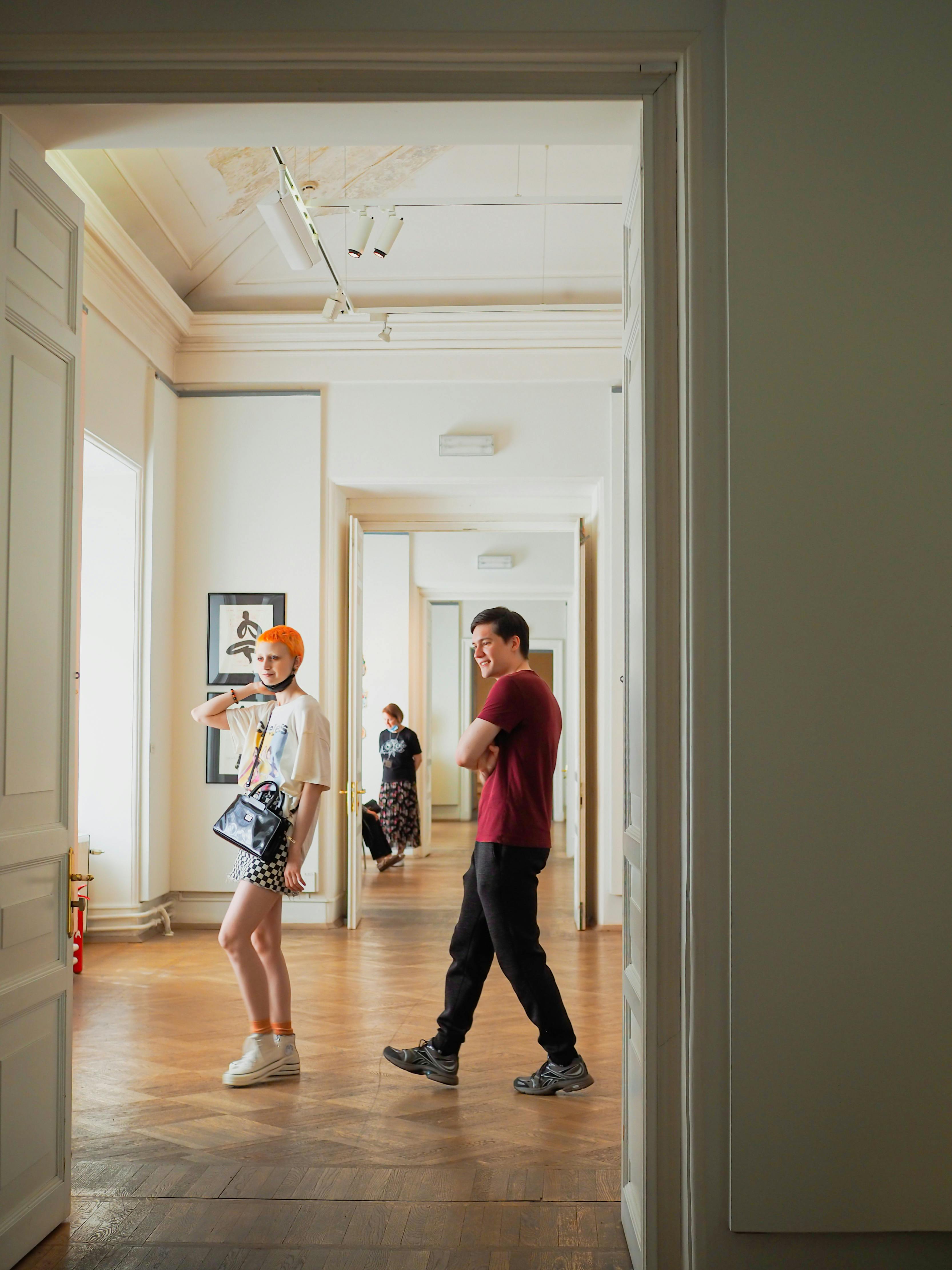 Person Standing in a Hallway in a Dark Room · Free Stock Photo