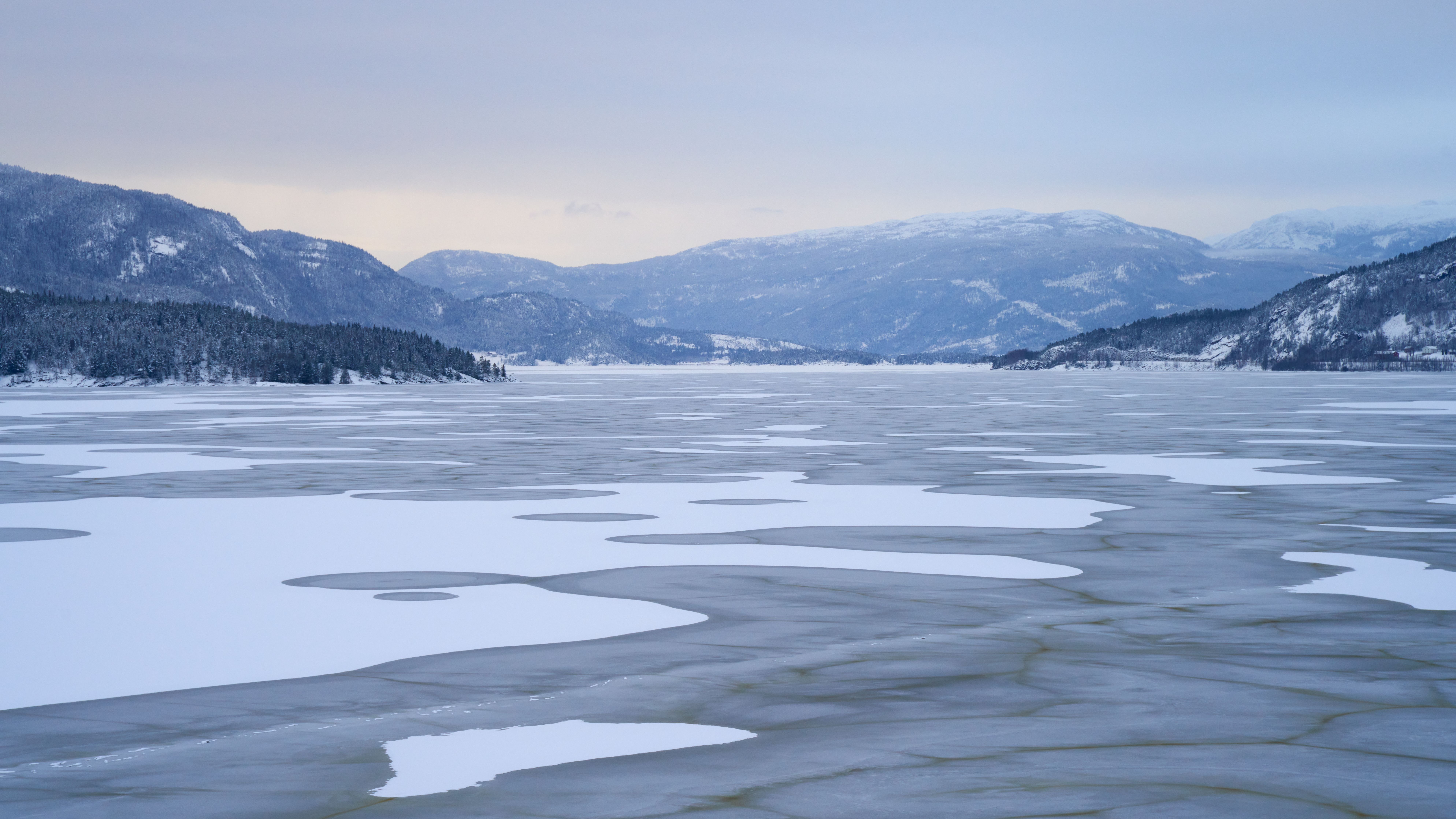 A Frozen Body of Water Near the Mountains · Free Stock Photo
