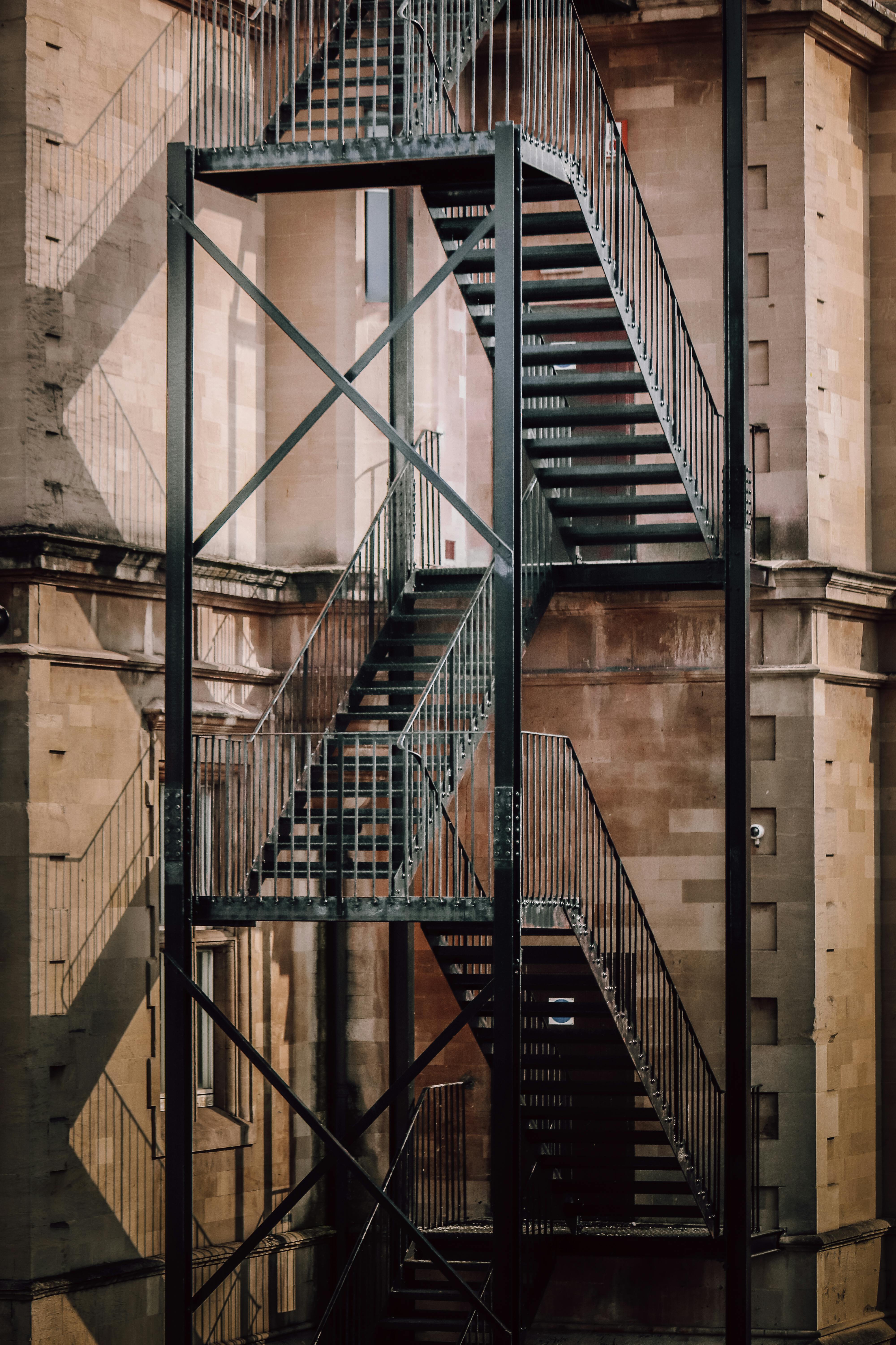 Black Metal Escape Ladder at Daytime · Free Stock Photo