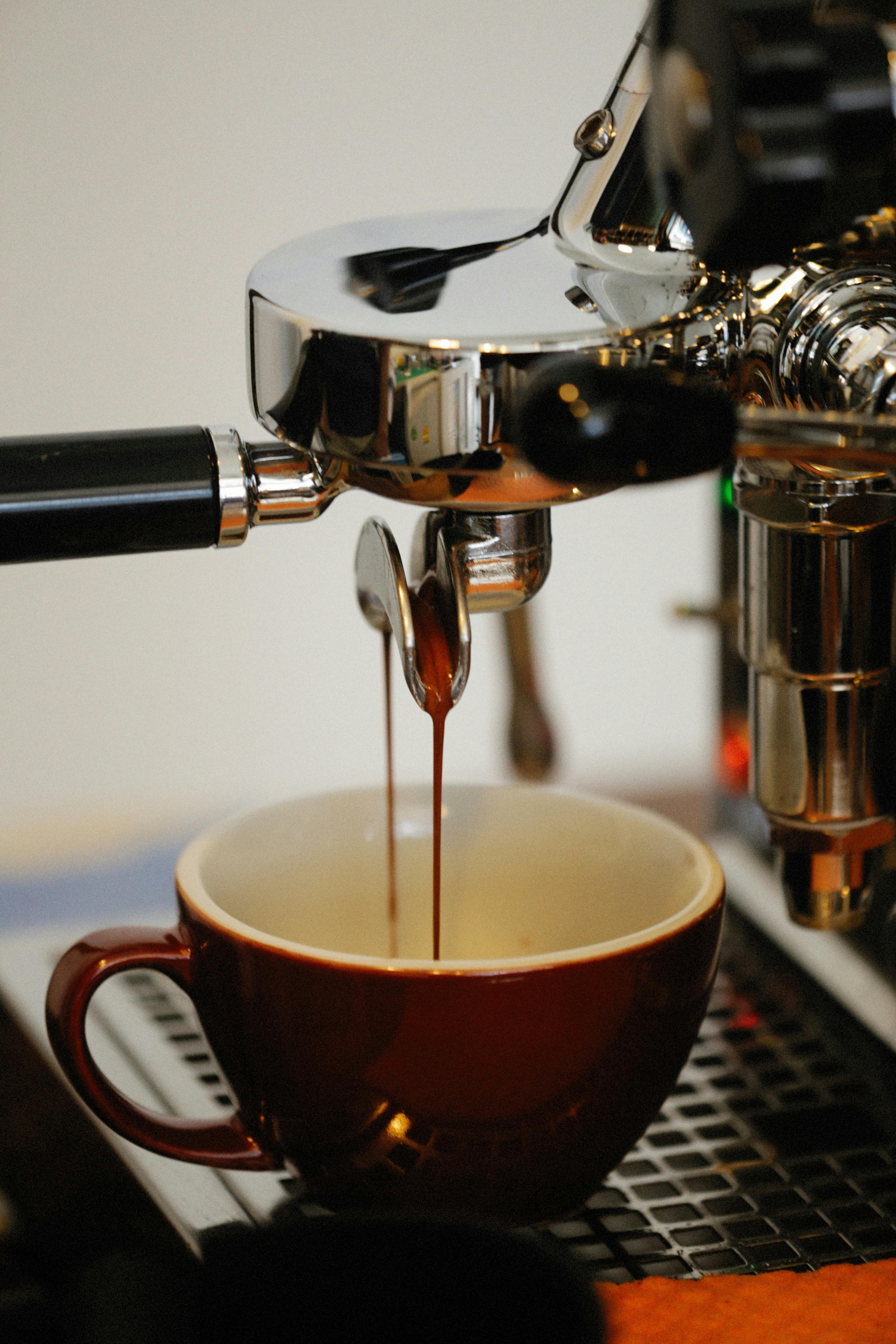 Close up of Pouring Coffee from Coffee Machine · Free Stock Photo