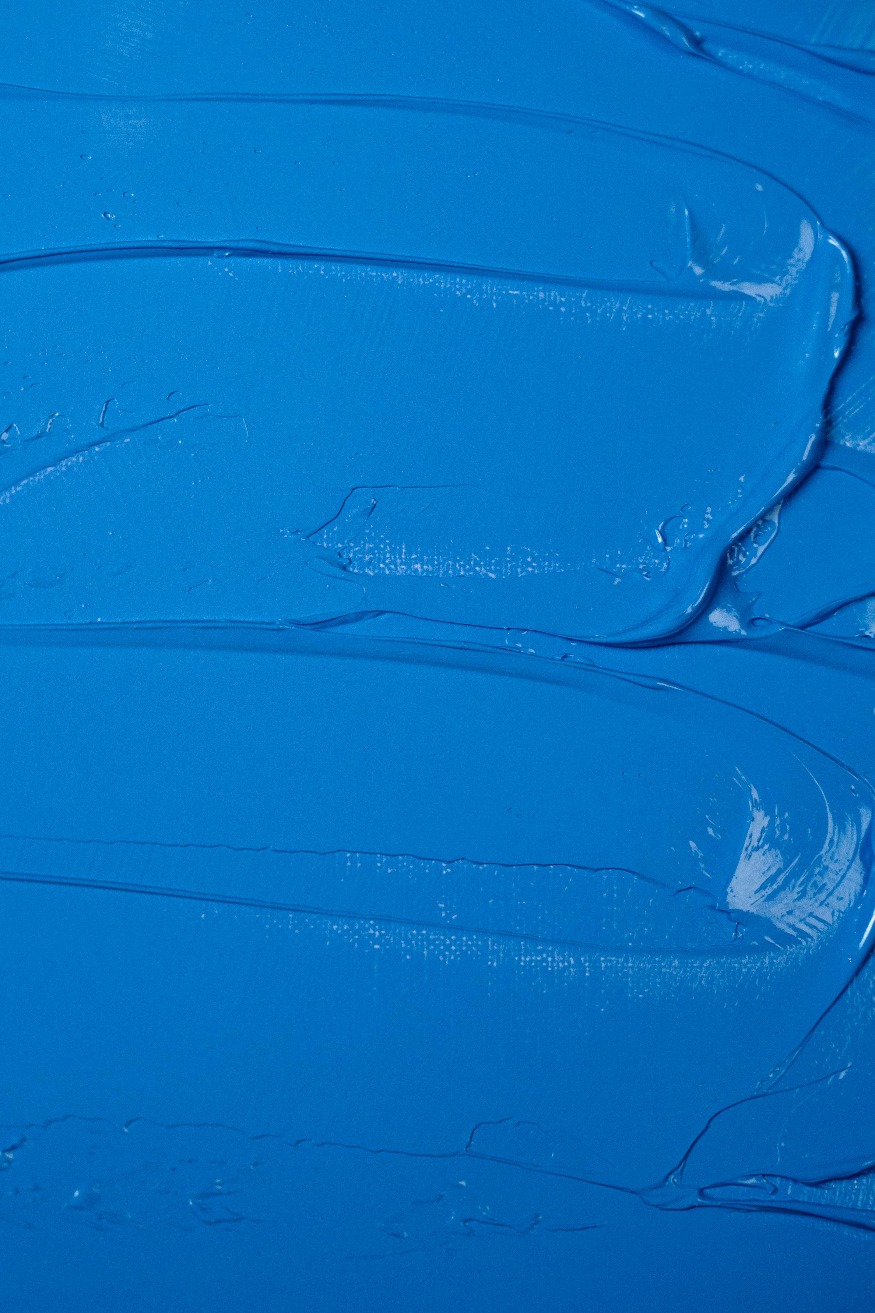 A Close Up of an Uneven Coat of Blue Paint · Free Stock Photo