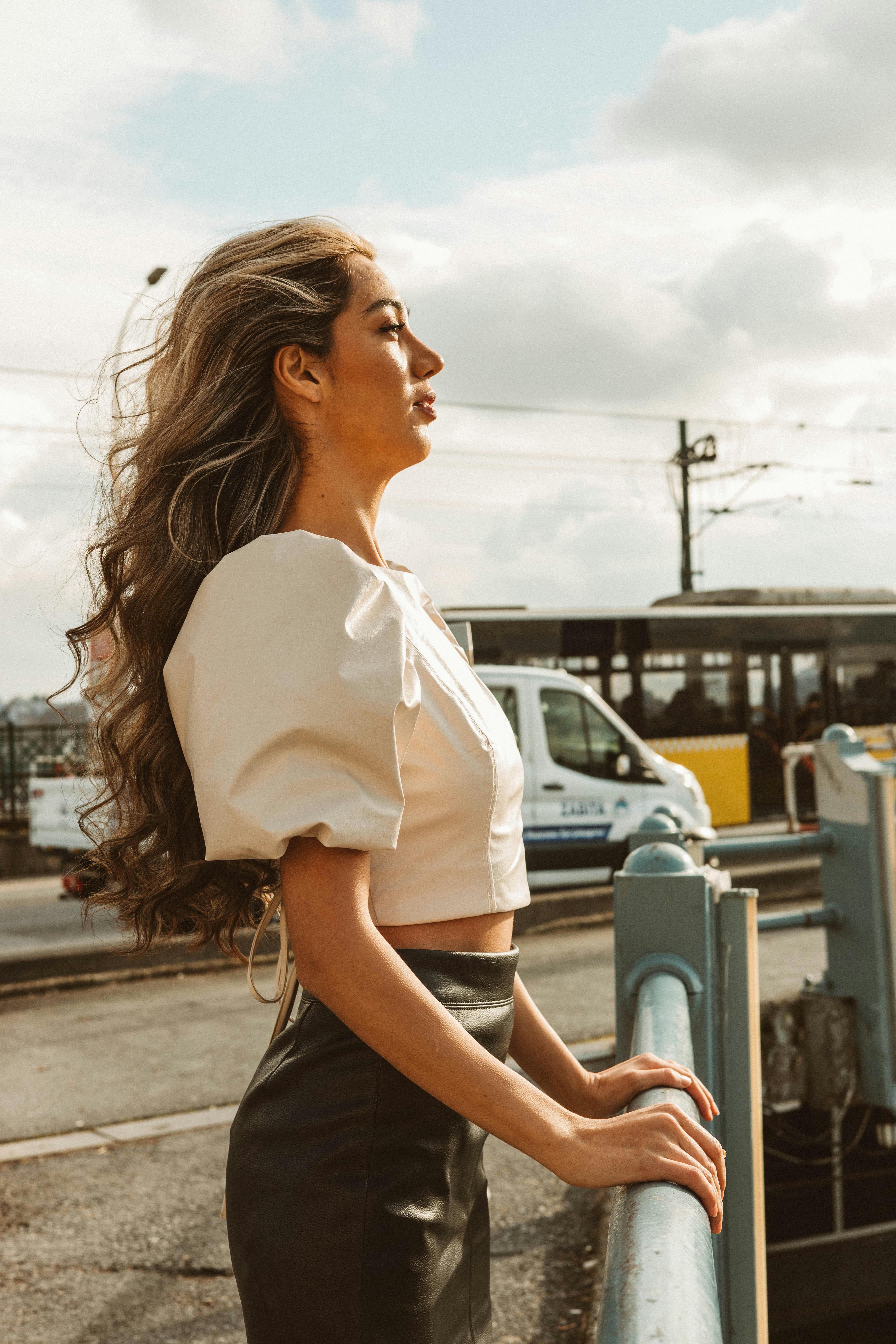 Side View of a Woman Wearing a White Top · Free Stock Photo