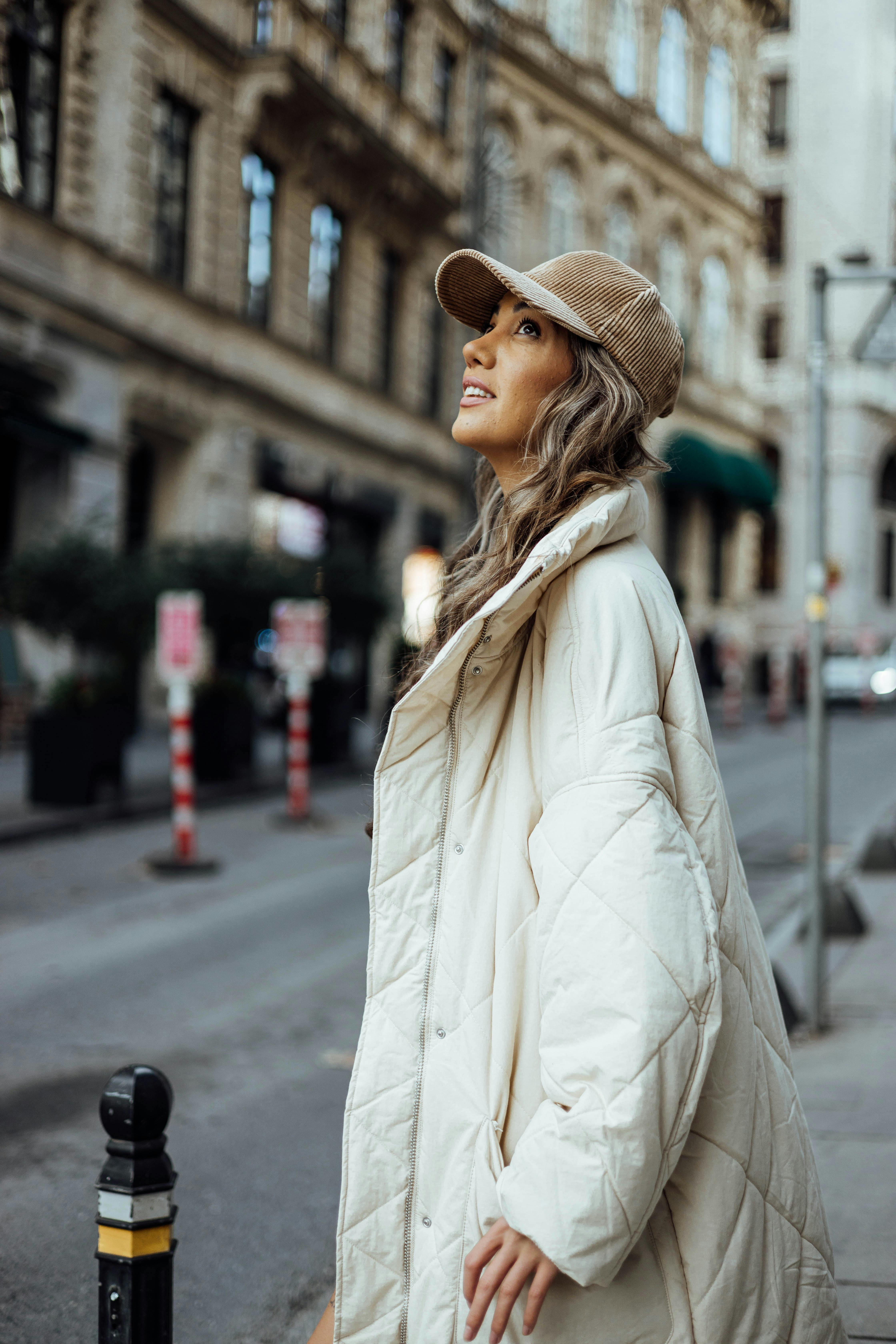 Woman Standing Near Post · Free Stock Photo