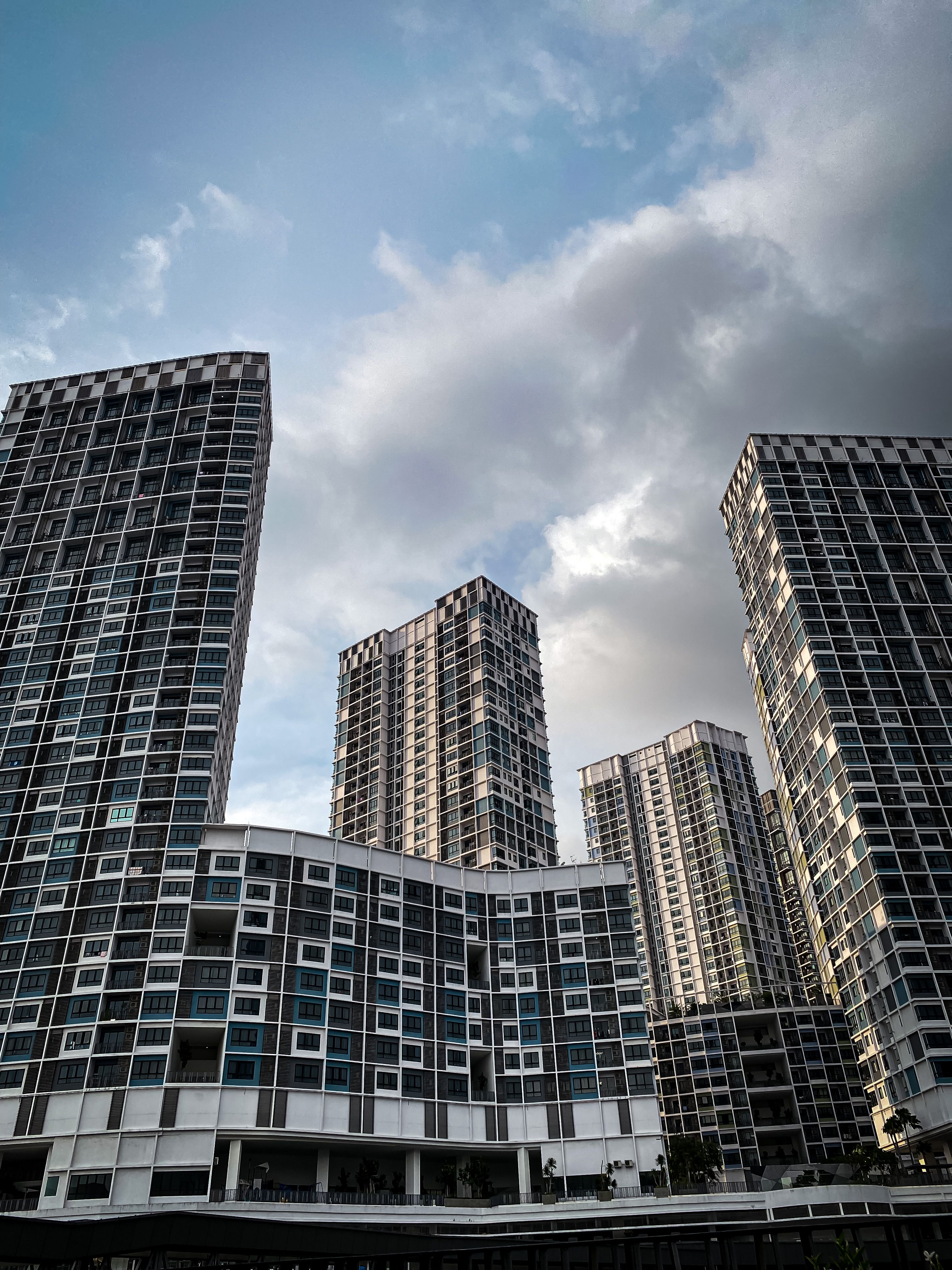 Apartment Buildings Under White Clouds · Free Stock Photo