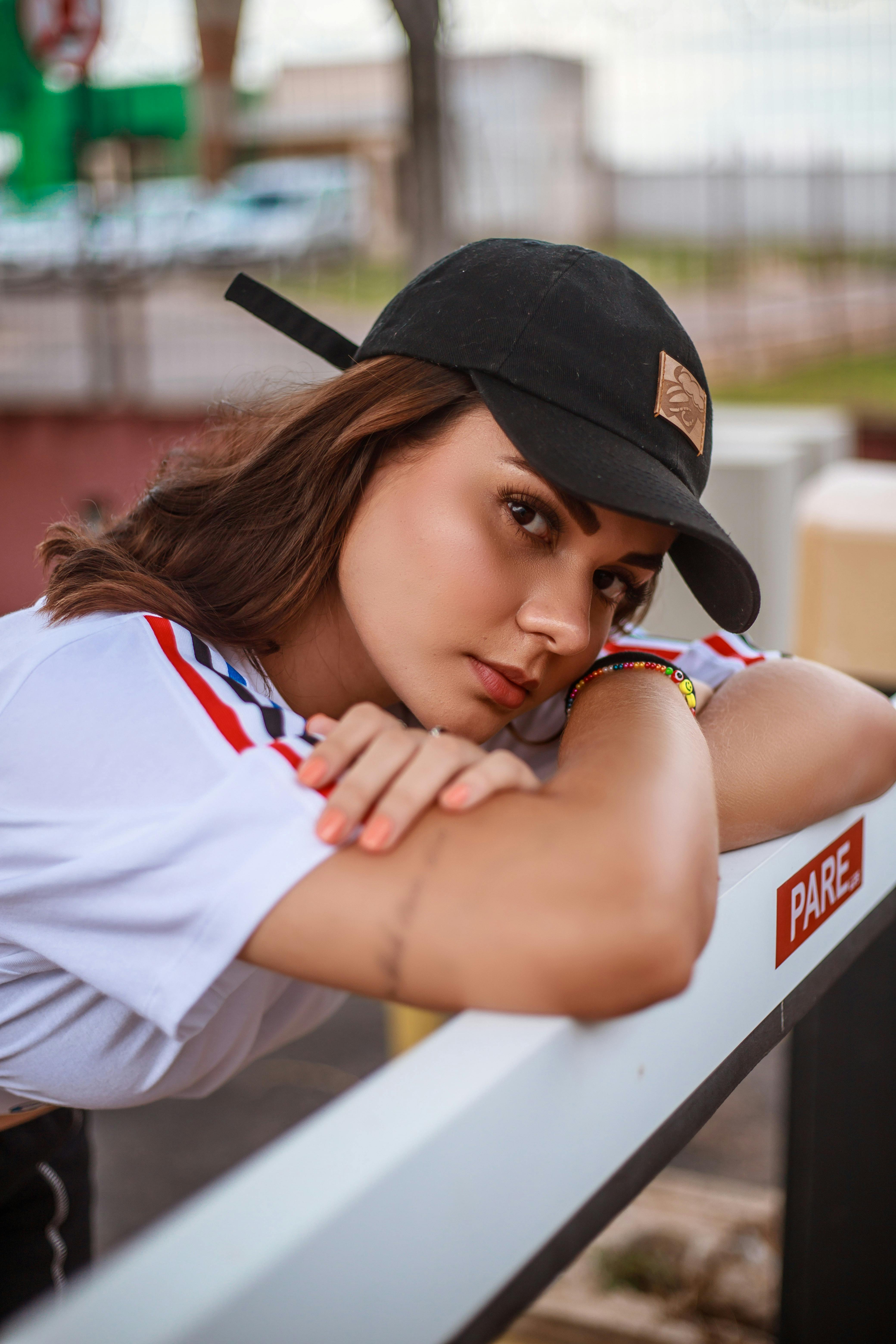 Woman in White Outfit Standing with Arms Crossed · Free Stock Photo