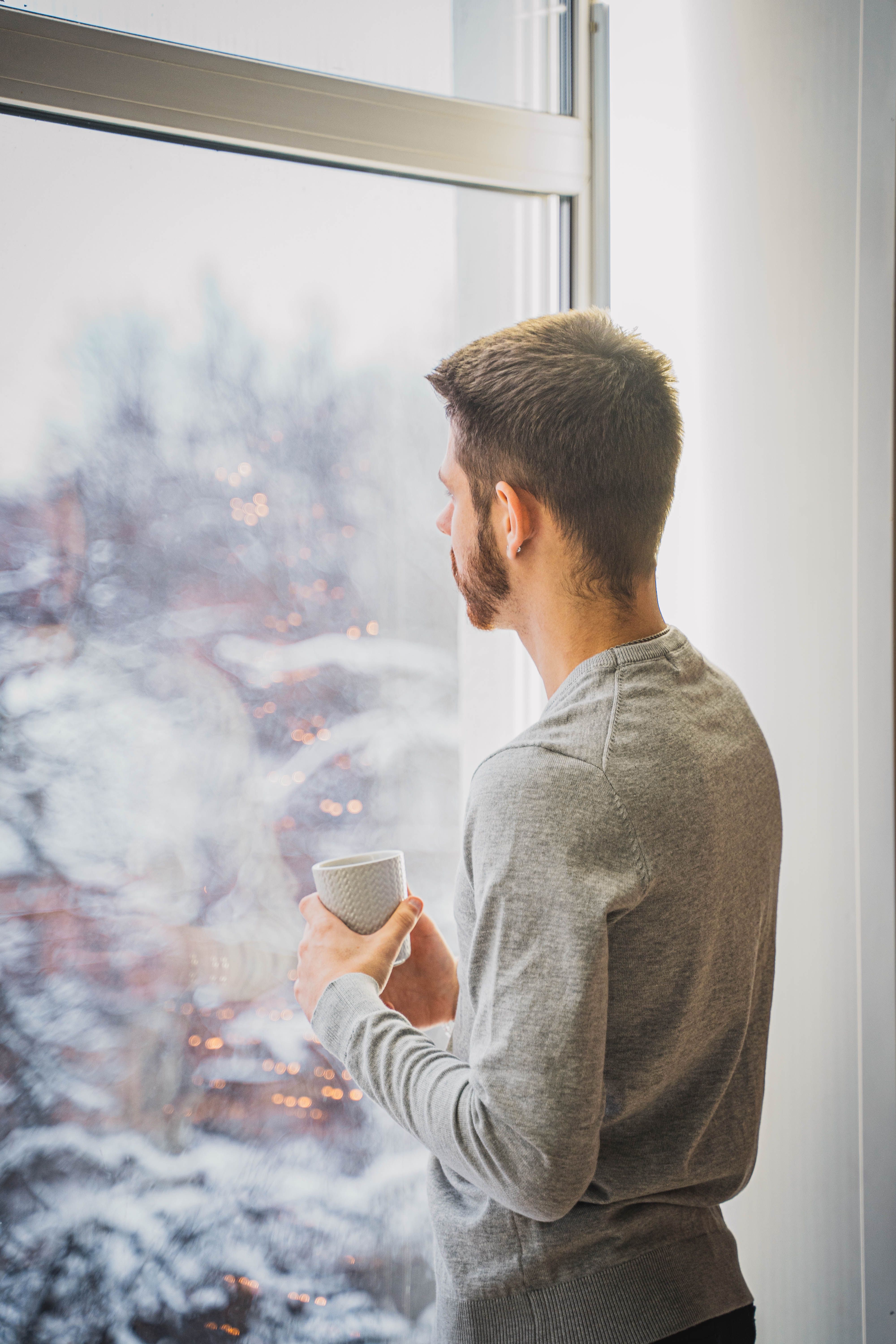 Man Looking Through Window · Free Stock Photo