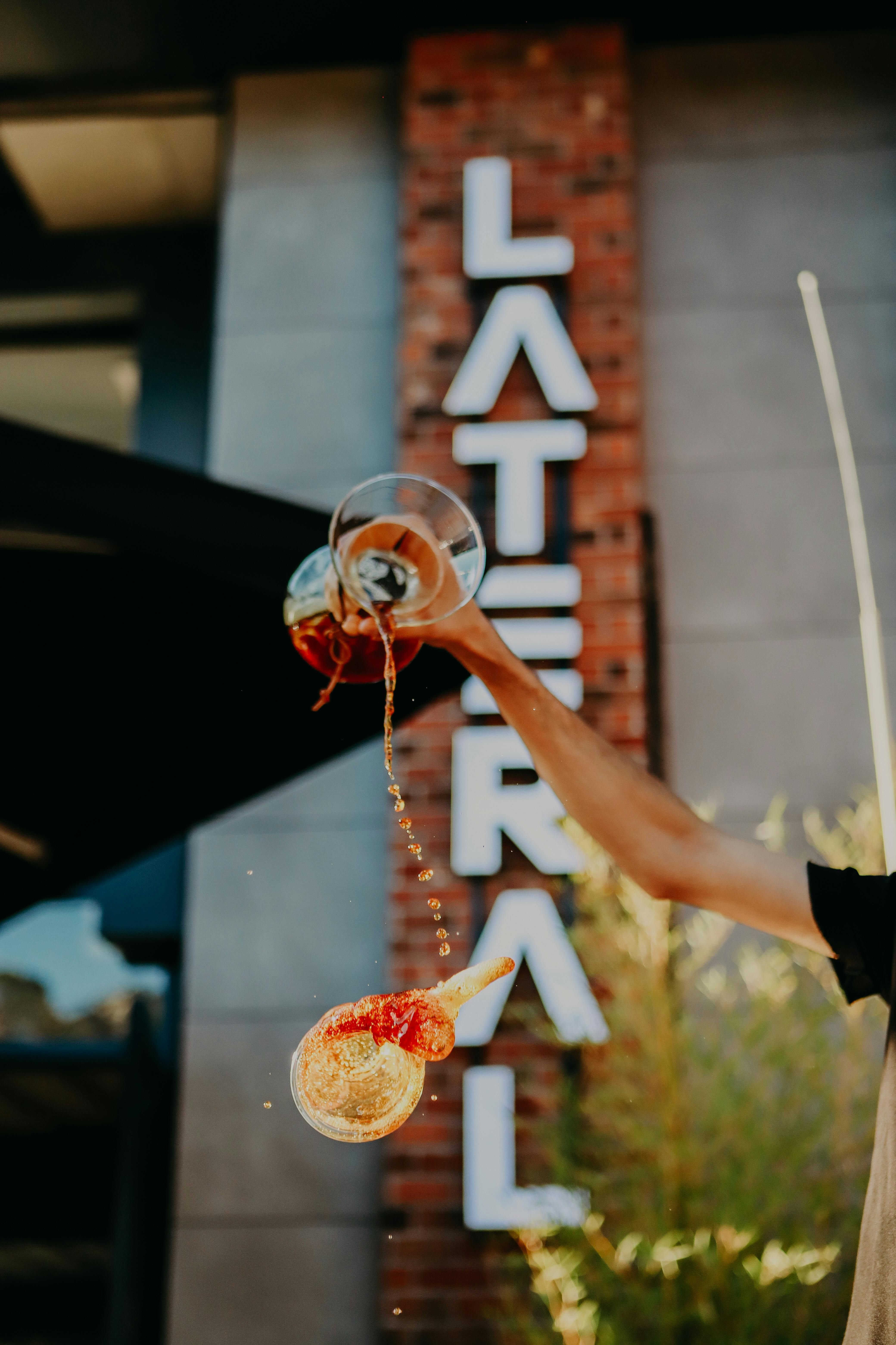 Spilling Cocktail on Ground · Free Stock Photo