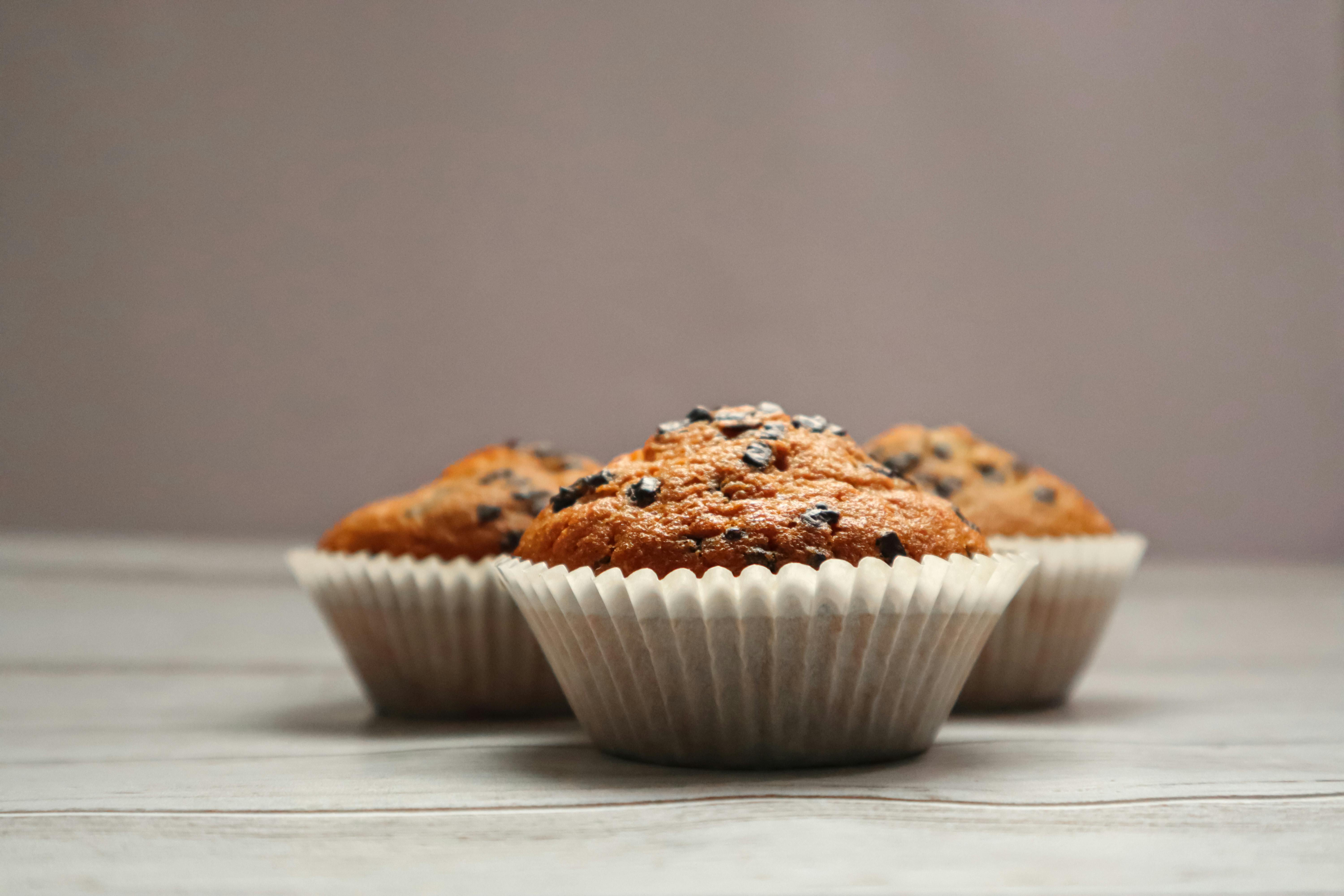 Brown Muffins on Wooden Table Top · Free Stock Photo