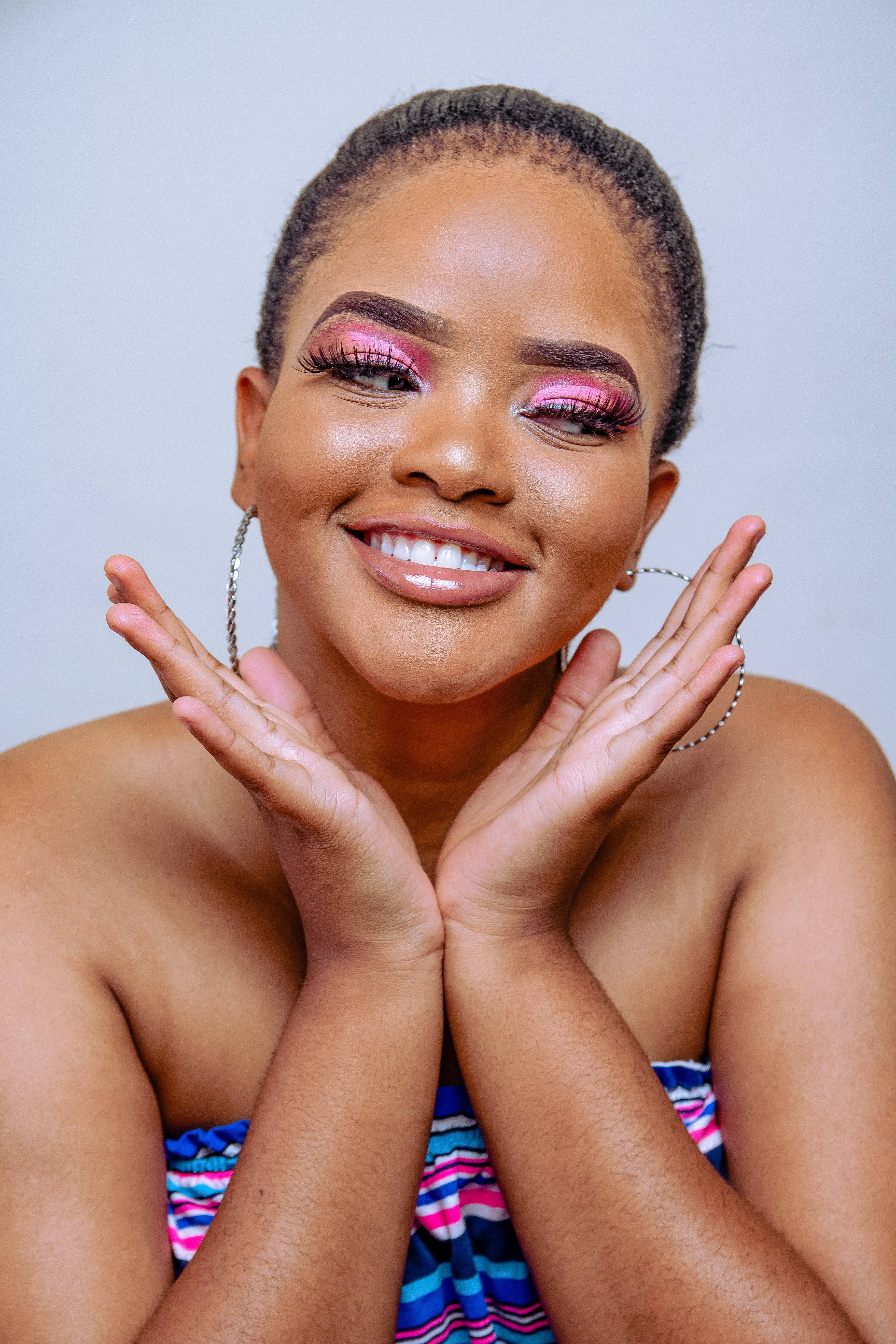 Portrait of a Woman with Pink Eye Shadows · Free Stock Photo