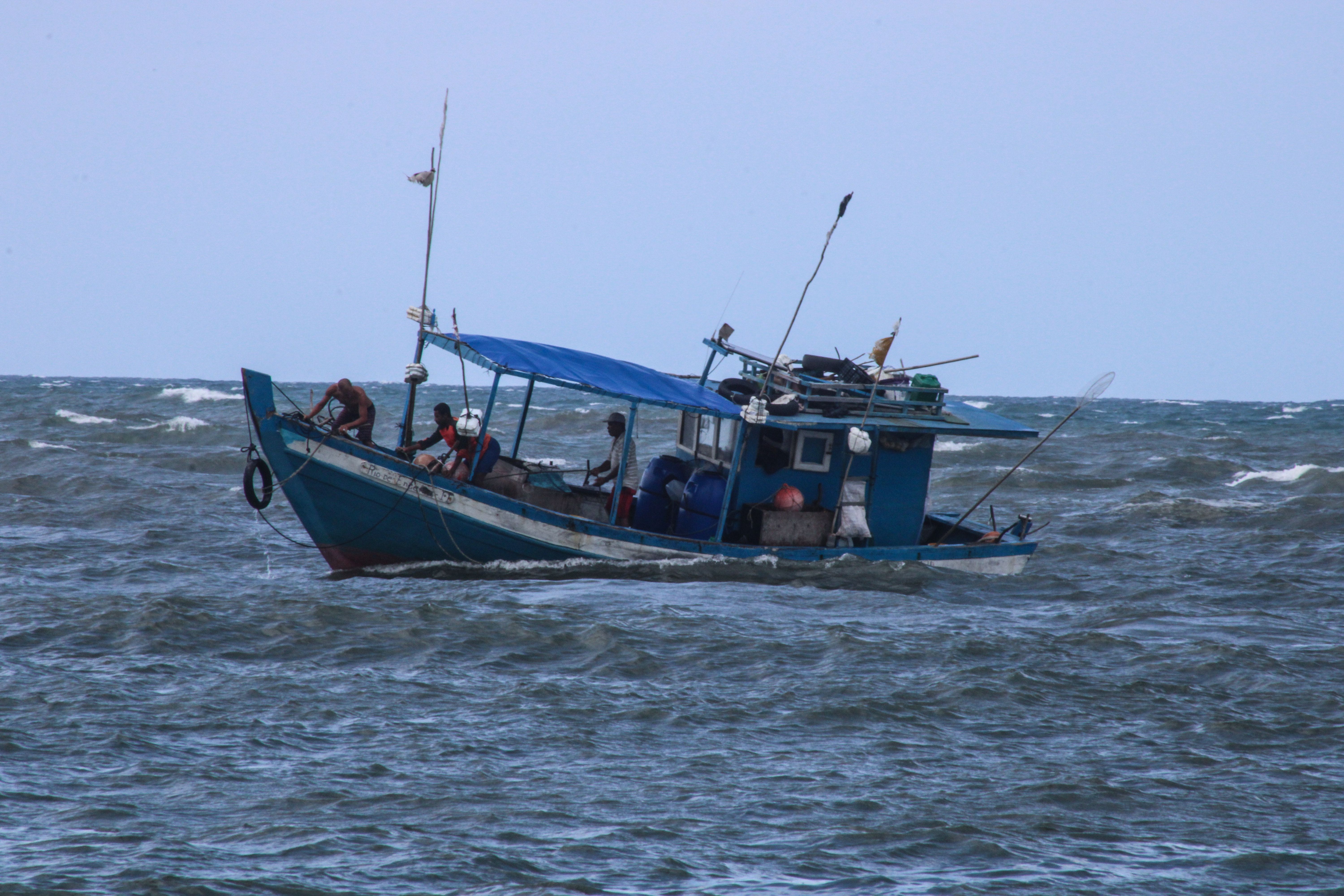 People Riding on Fishing Boat on Sea · Free Stock Photo