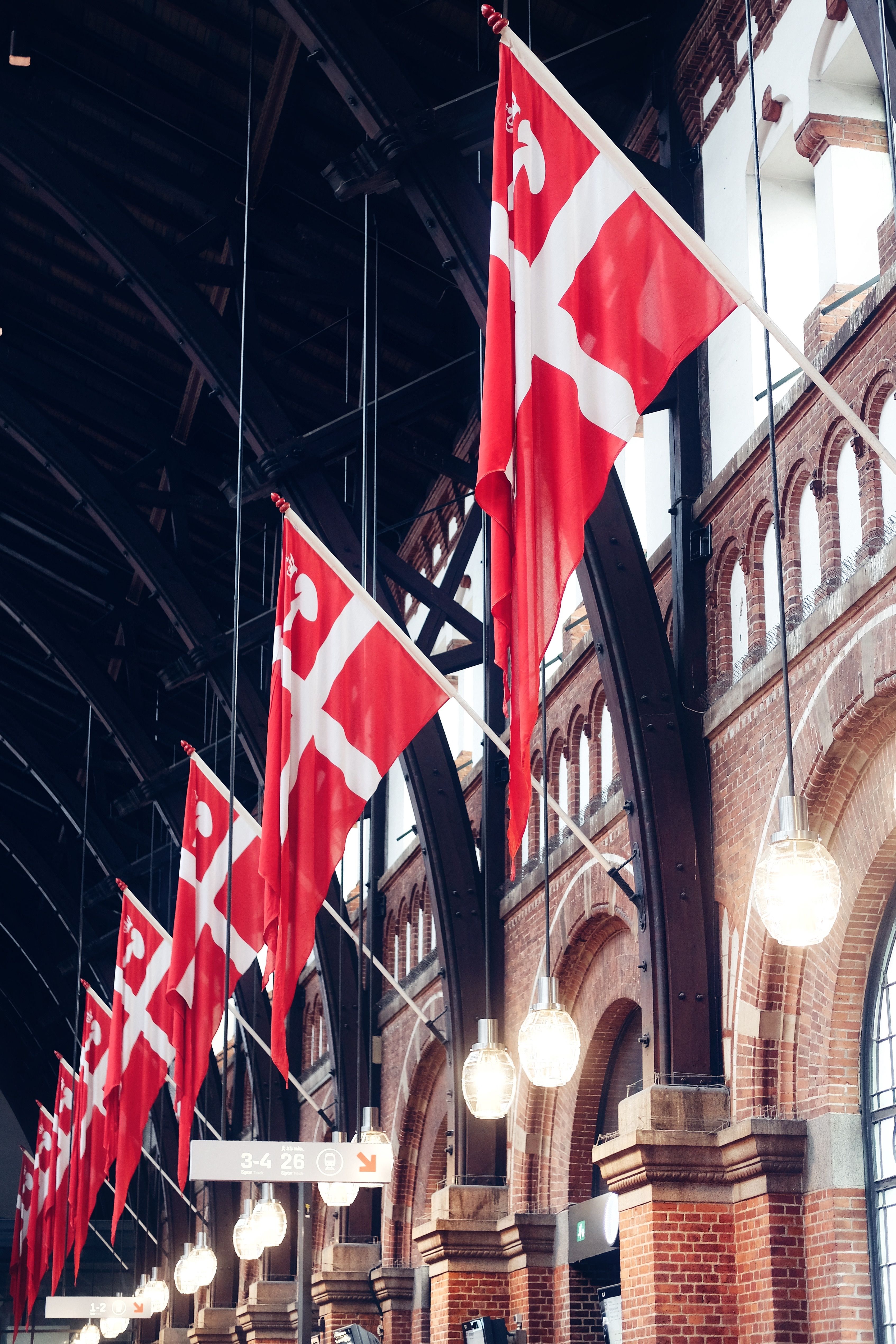 Flags in Copenhagen Central Station · Free Stock Photo