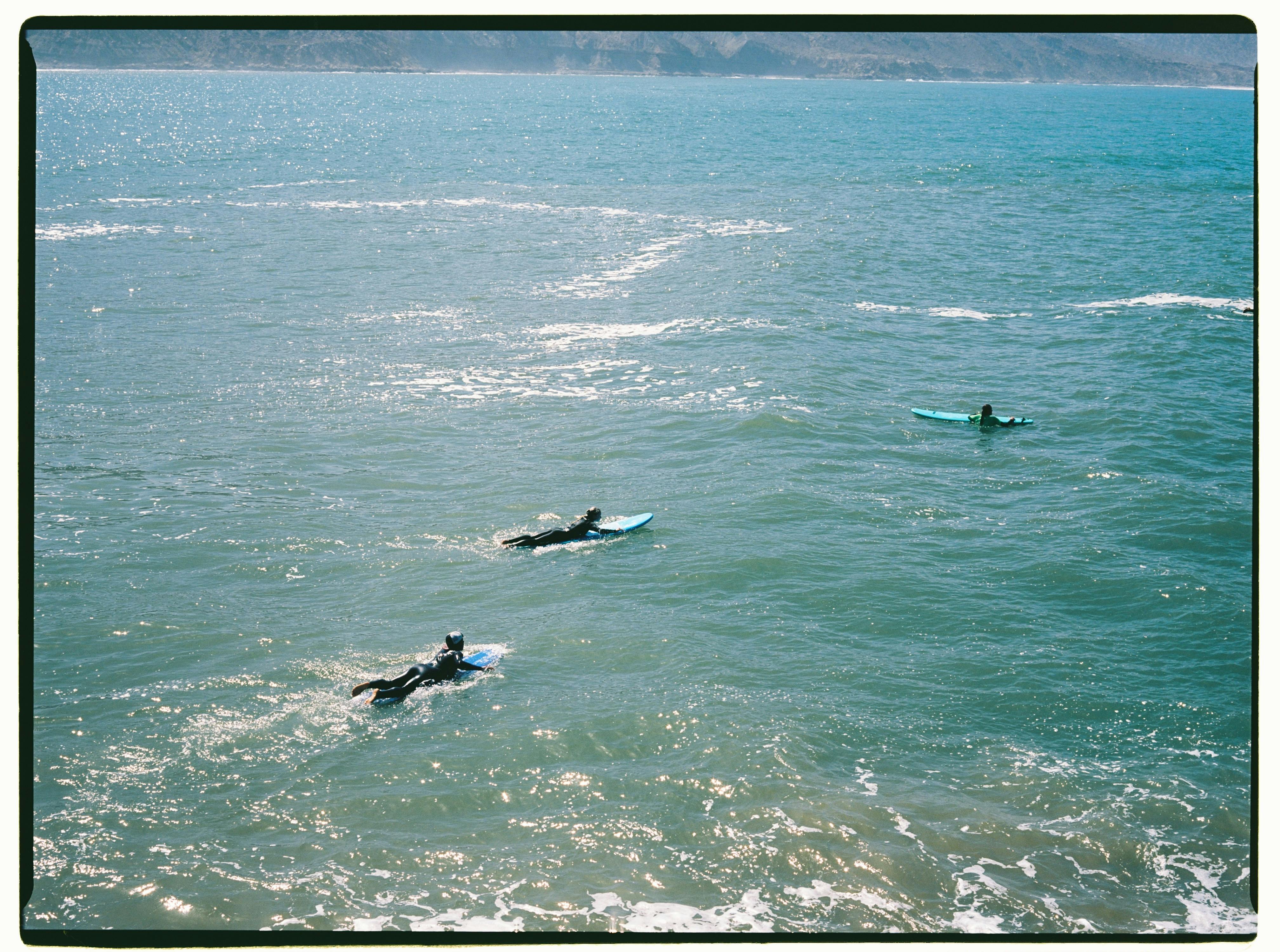 Aerial View Of People Surfing On Sea Waves · Free Stock Photo
