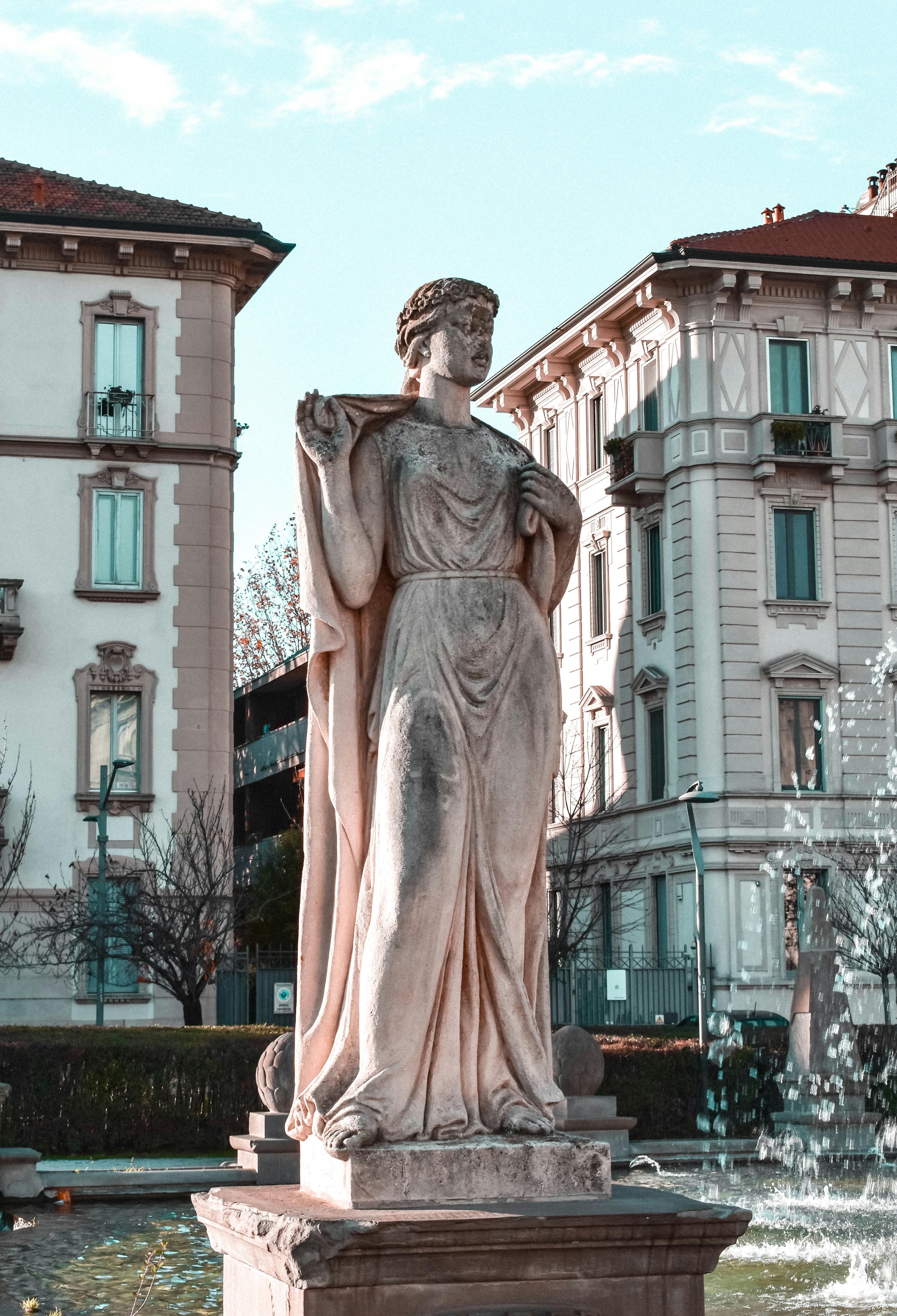 A Woman Figure Statue Near the Fountain · Free Stock Photo