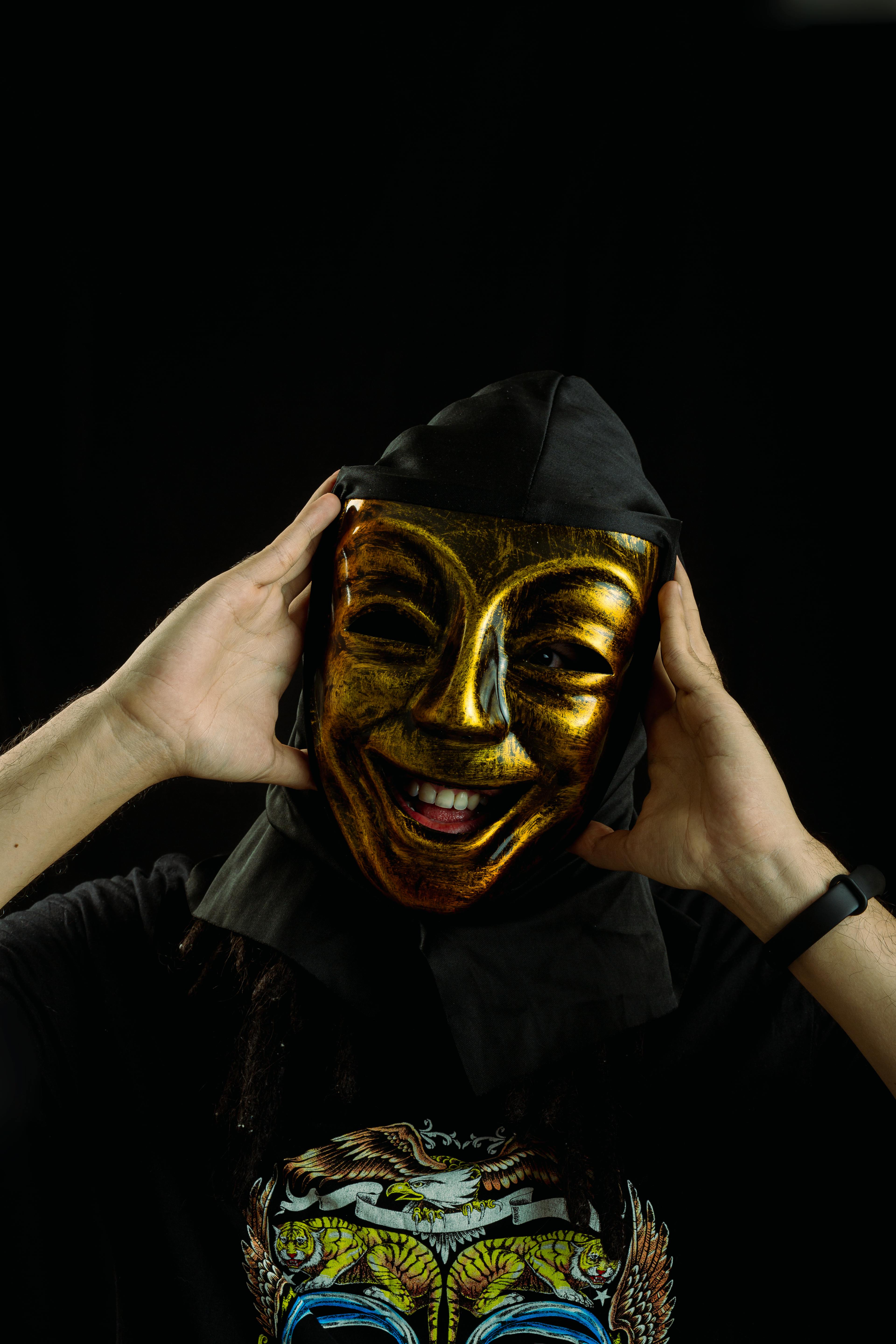 Close-Up Shot of a Person Wearing a Robber Mask · Free Stock Photo