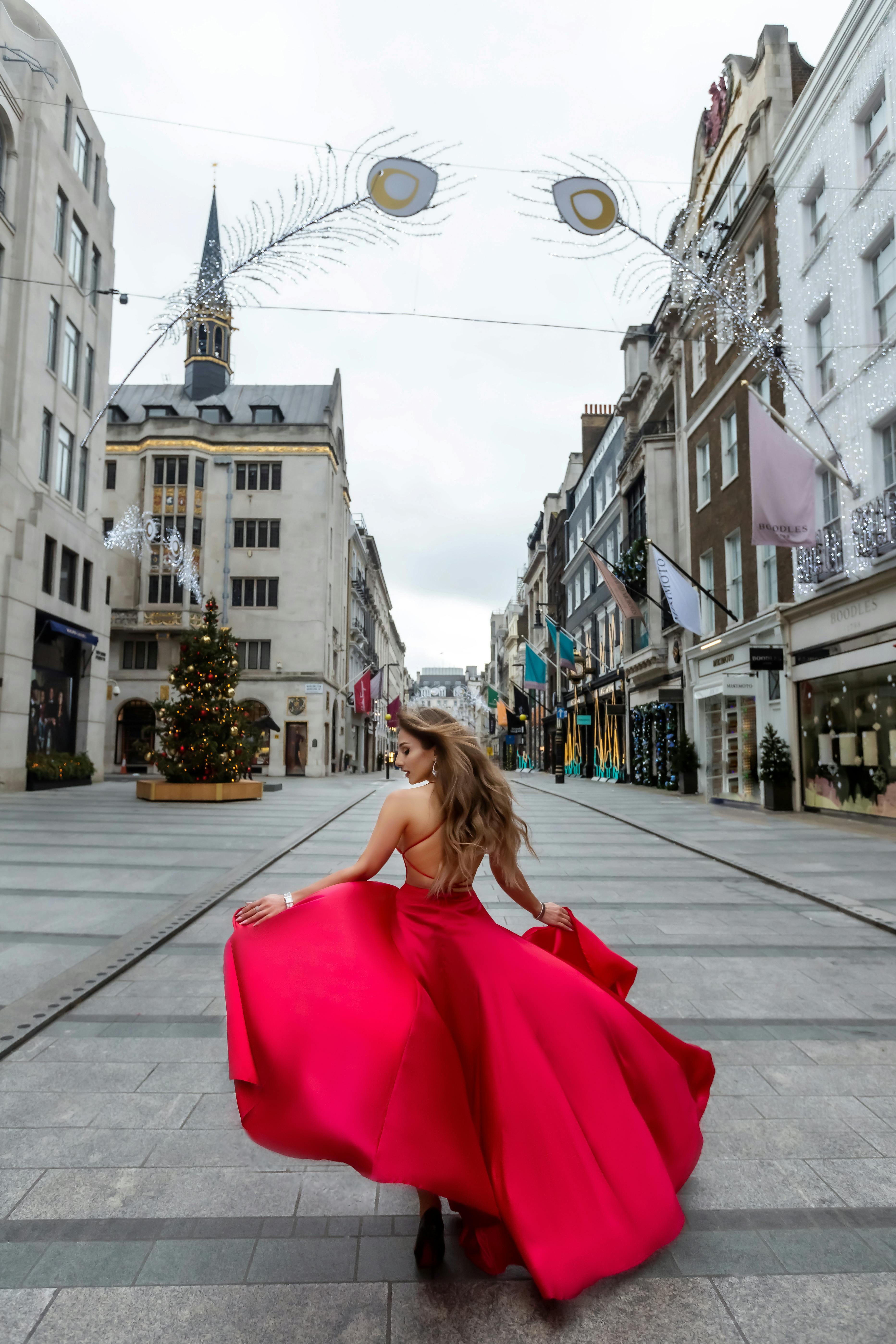 Woman in Red Dress Standing on Sidewalk · Free Stock Photo