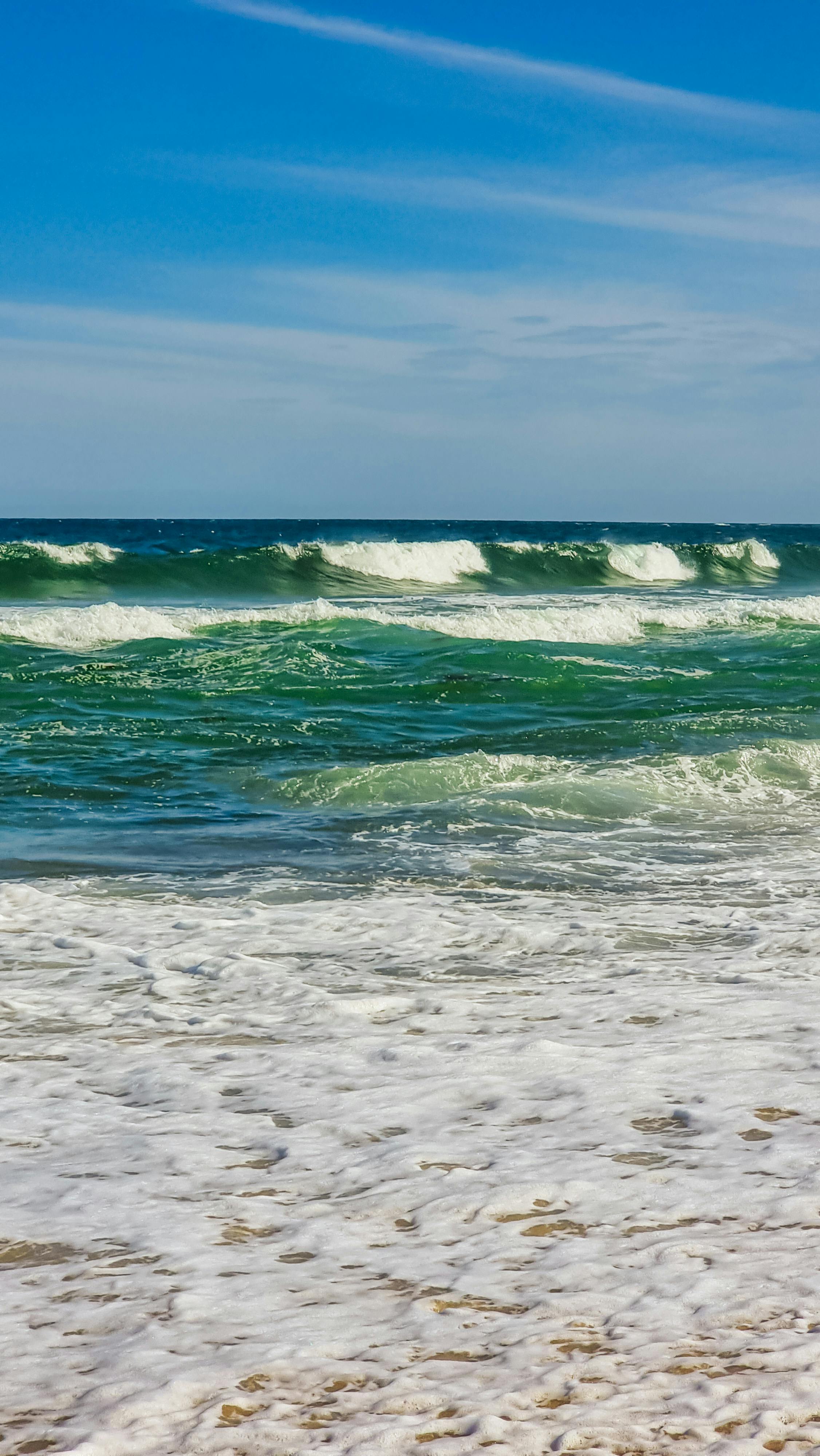 An Ocean Waves Under the Blue Sky · Free Stock Photo