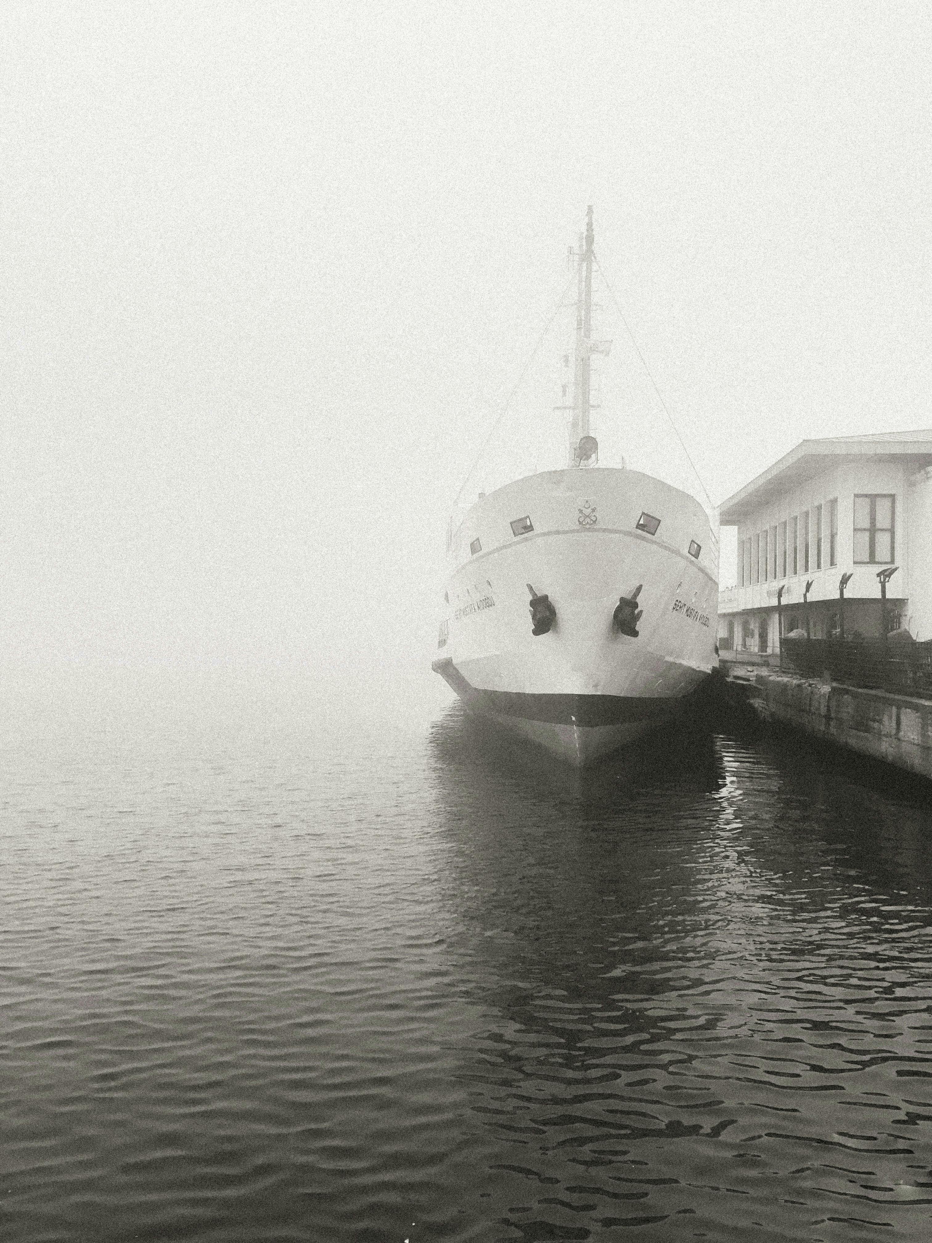 Grayscale Photo of Ship on Water · Free Stock Photo