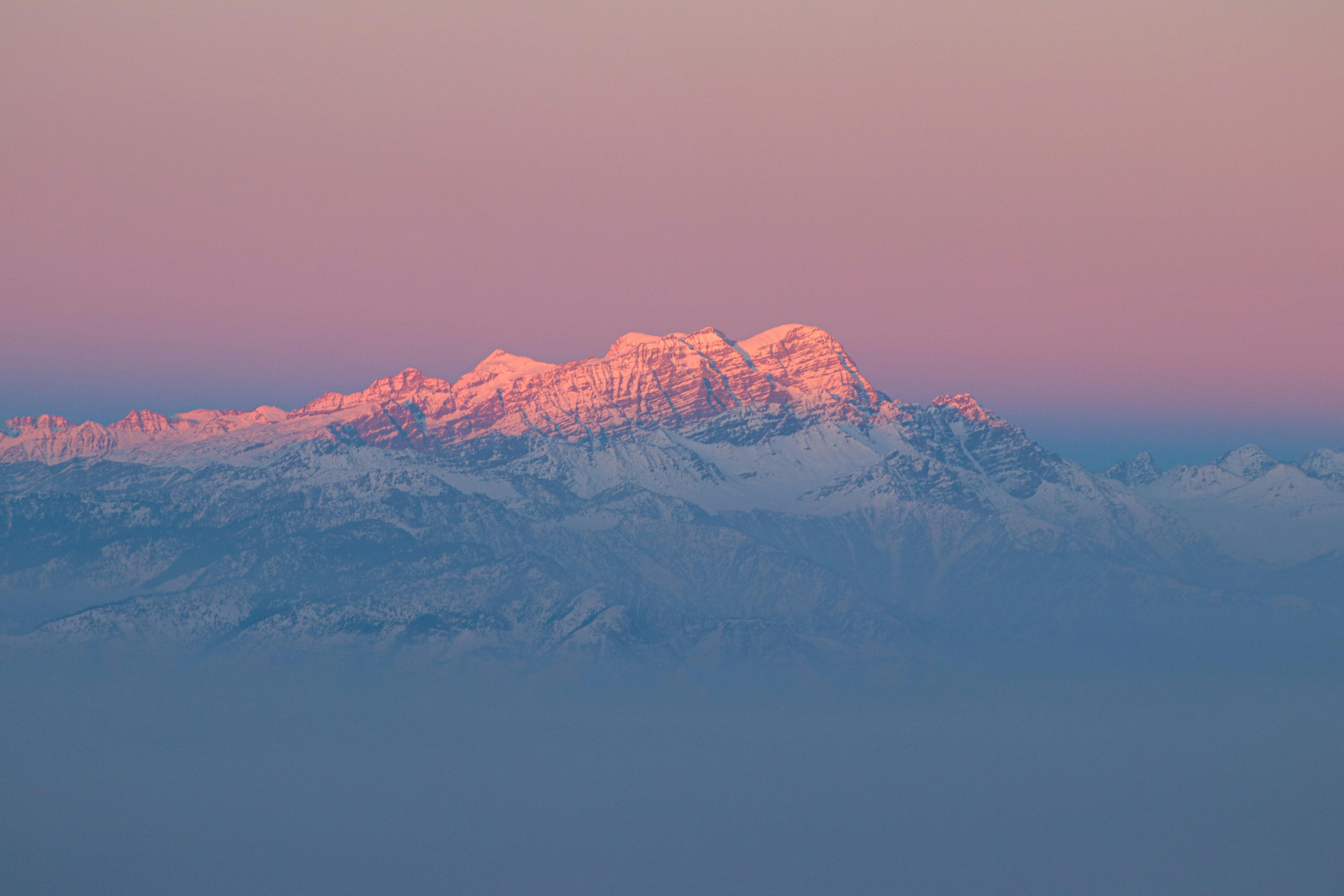 Pink Sky over a Snow Capped Mountain · Free Stock Photo