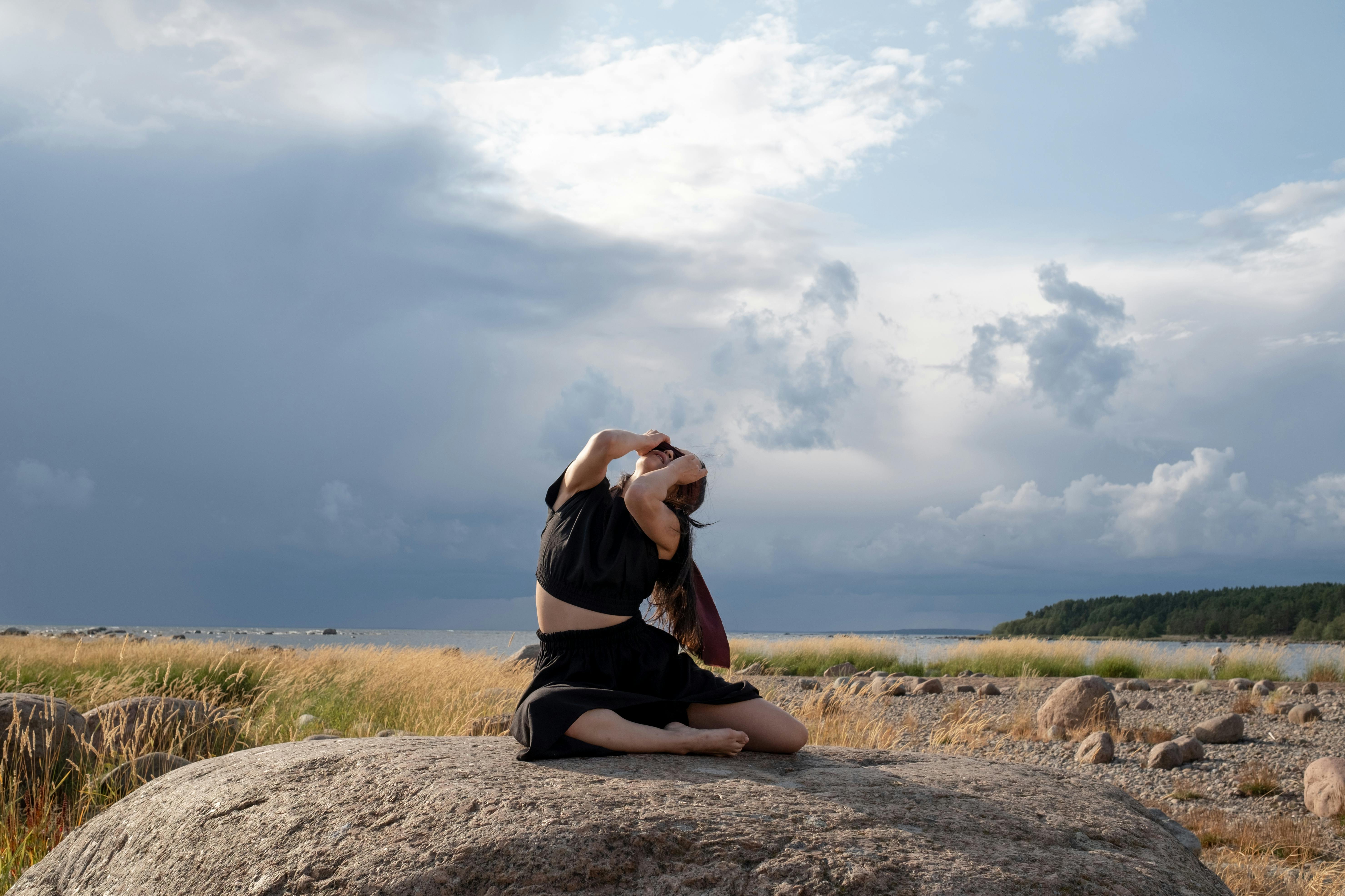 Women Sitting on a Big Rock · Free Stock Photo
