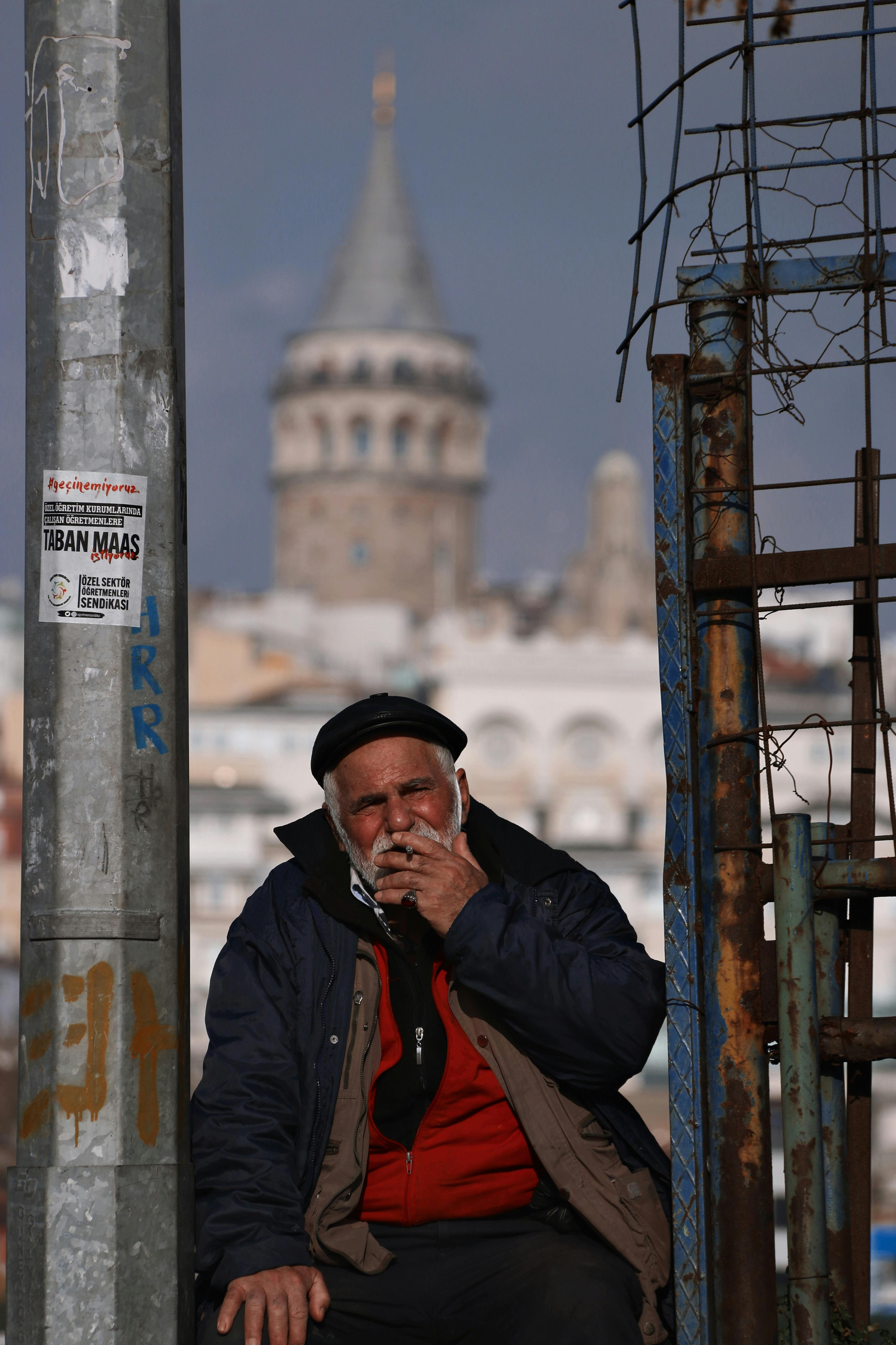 Man with Tattoo on Neck Smoking Cigarette · Free Stock Photo