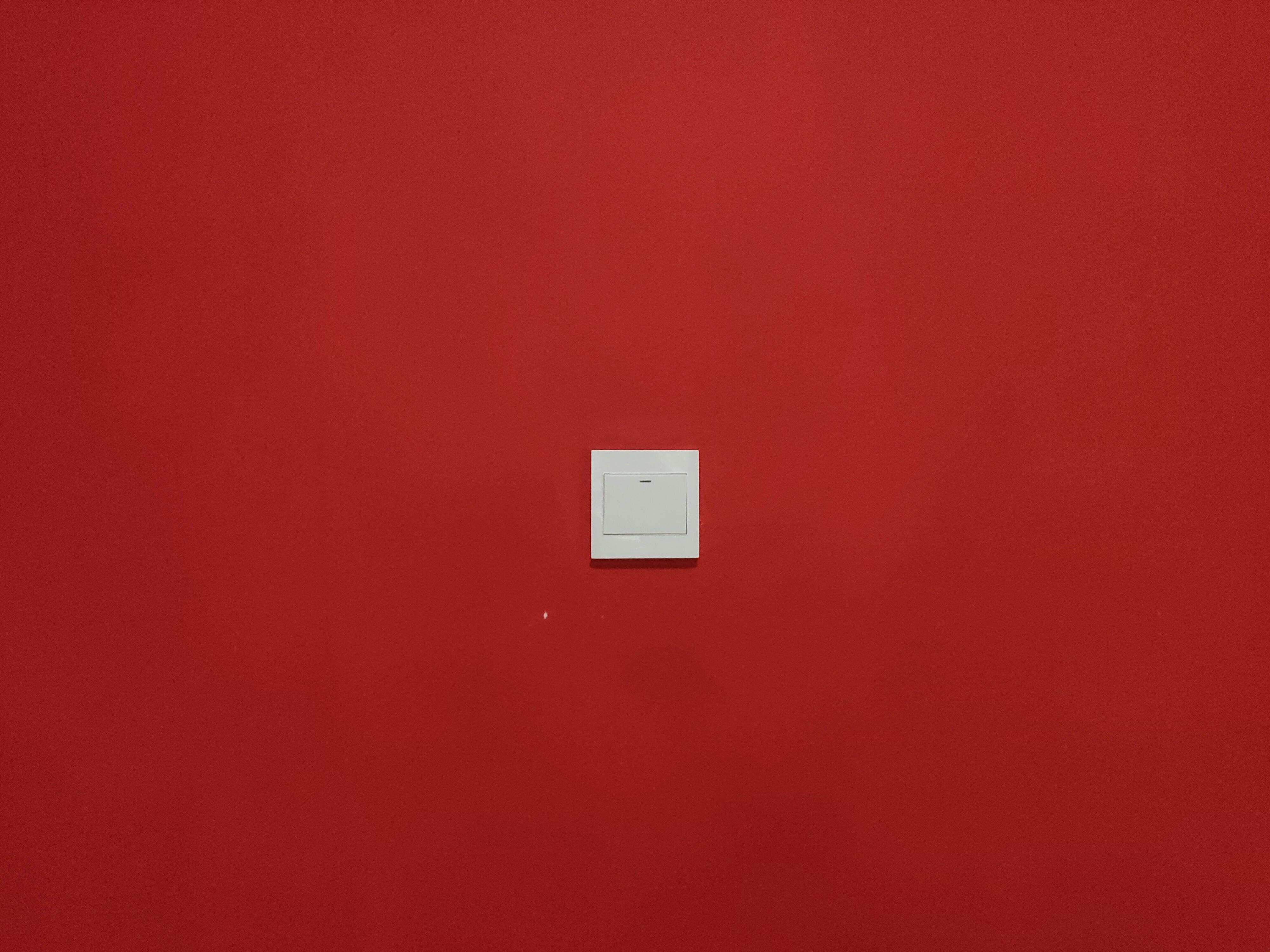 White Square Light Switch on a Red Wall · Free Stock Photo