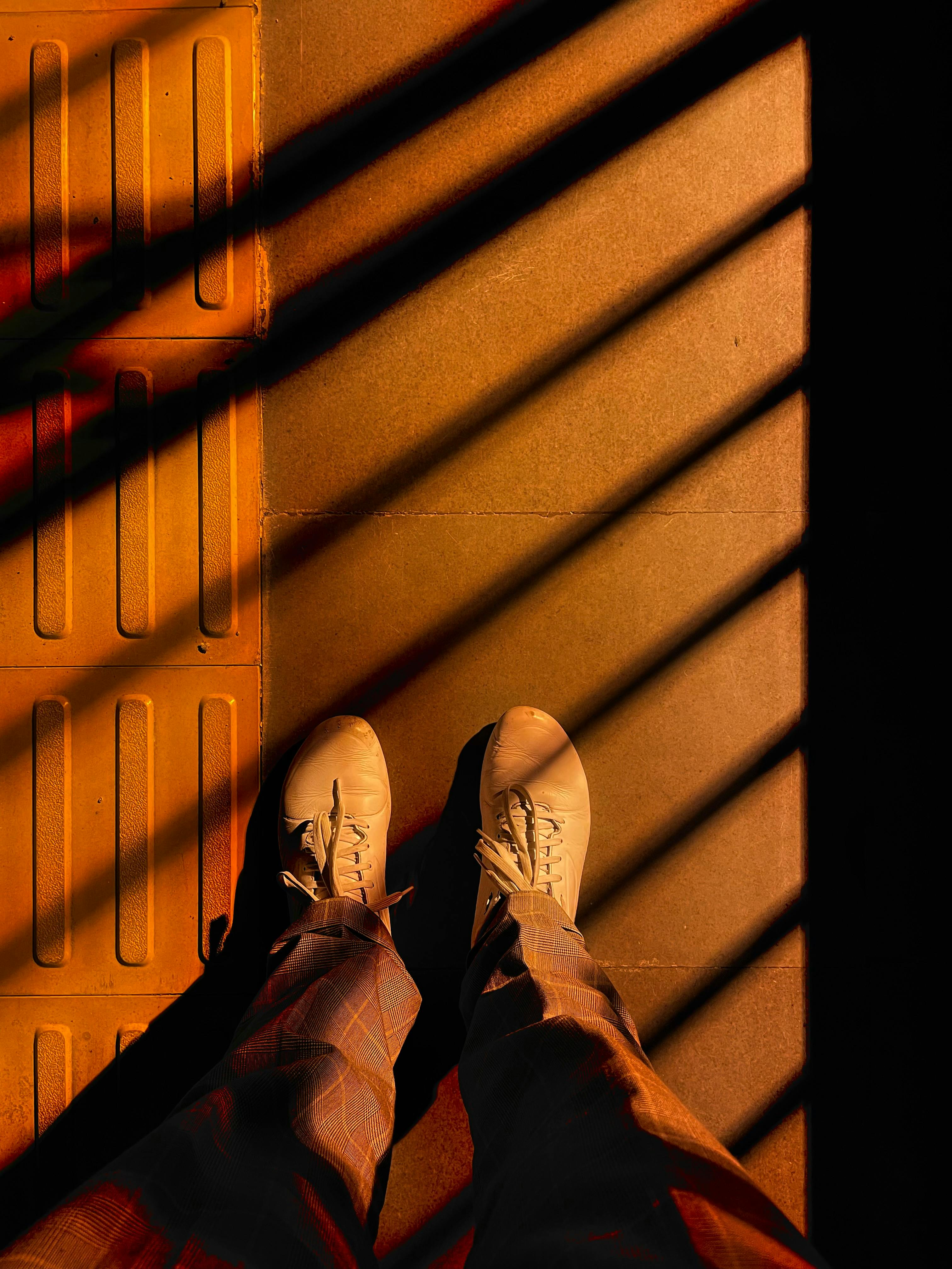 Man Crouching and Shadow on Floor · Free Stock Photo