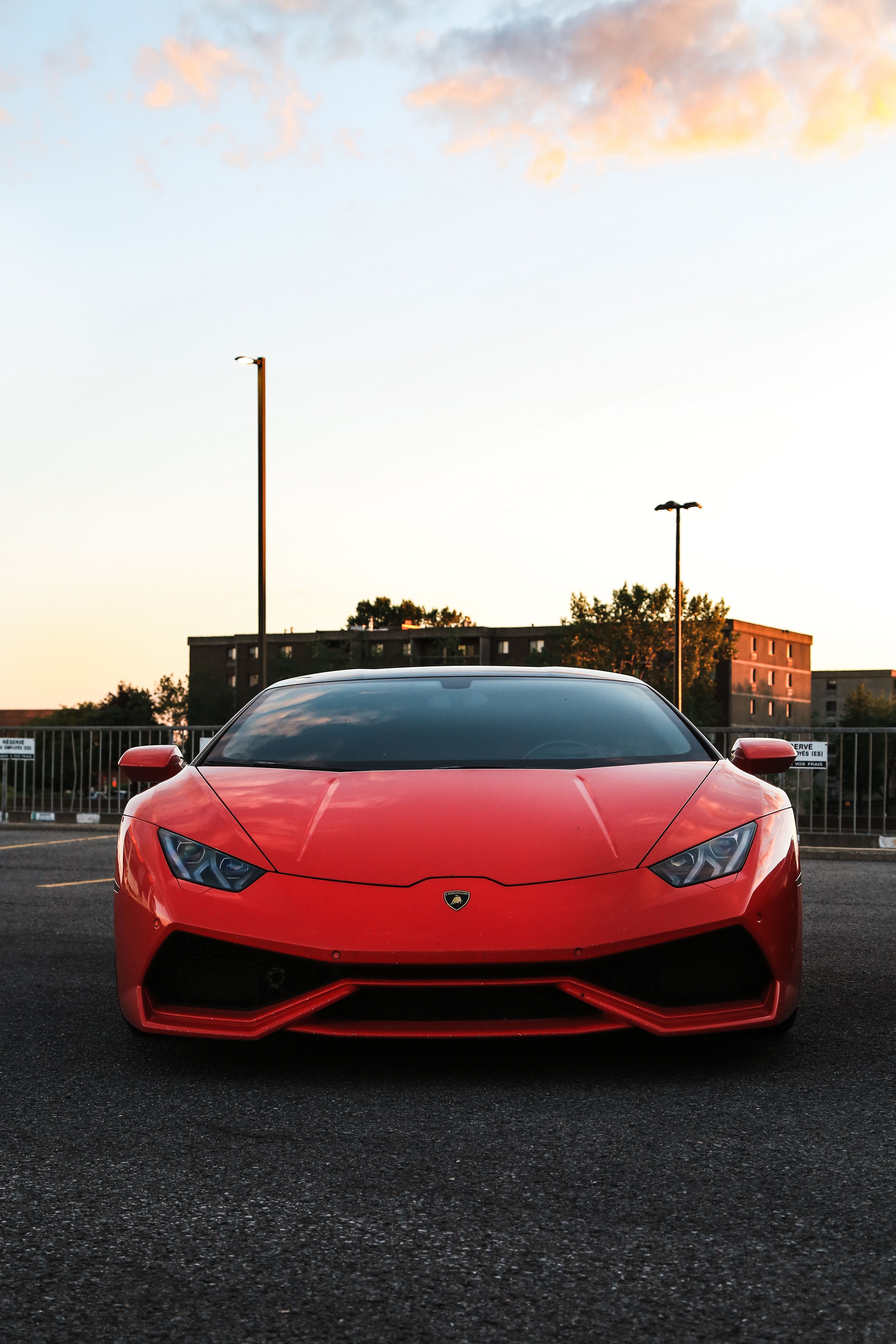 Bright Headlights of a Luxury Red Car · Free Stock Photo