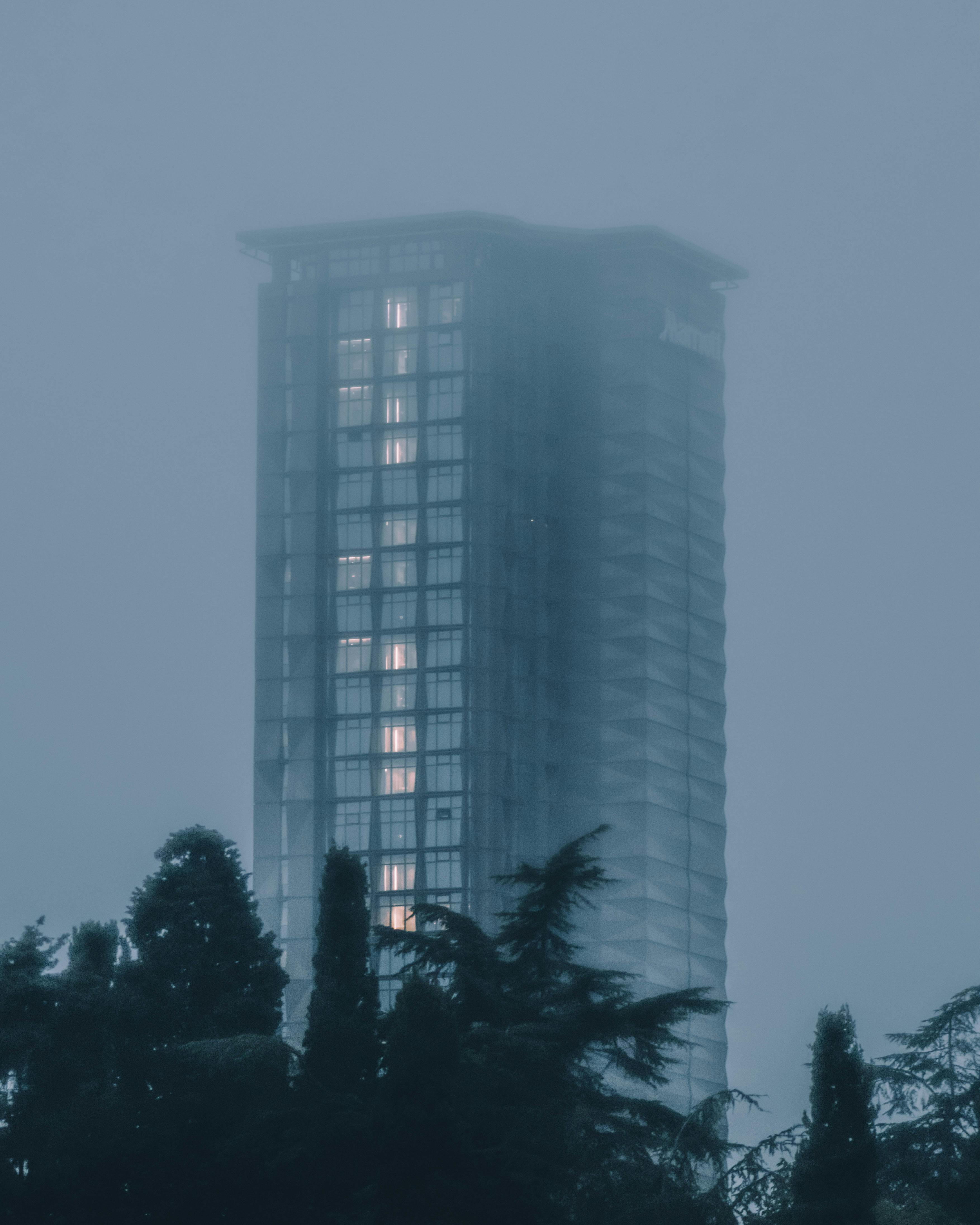 A High Rise Building Illuminated at Night · Free Stock Photo