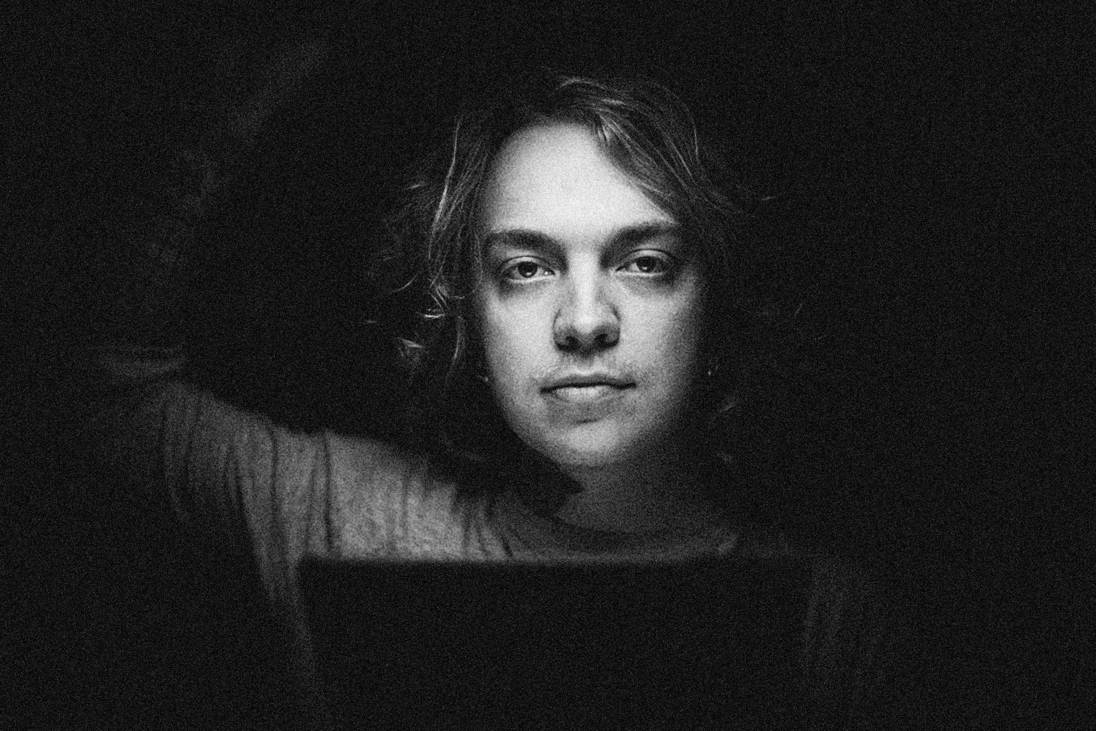 Grayscale Photo of a Person on Black Background · Free Stock Photo