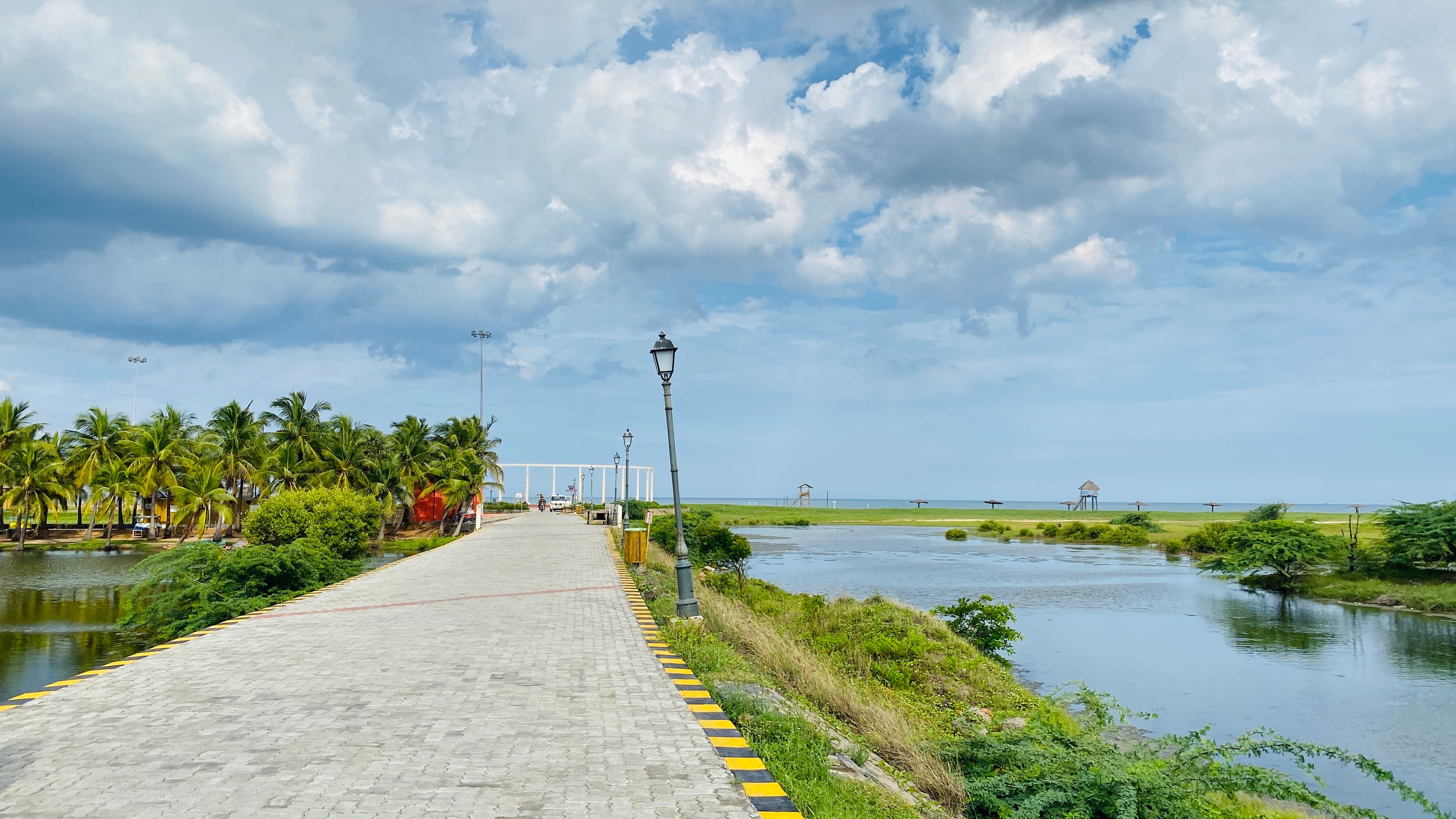 Gray Concrete Pathway Near Body of Water Under White Clouds · Free ...
