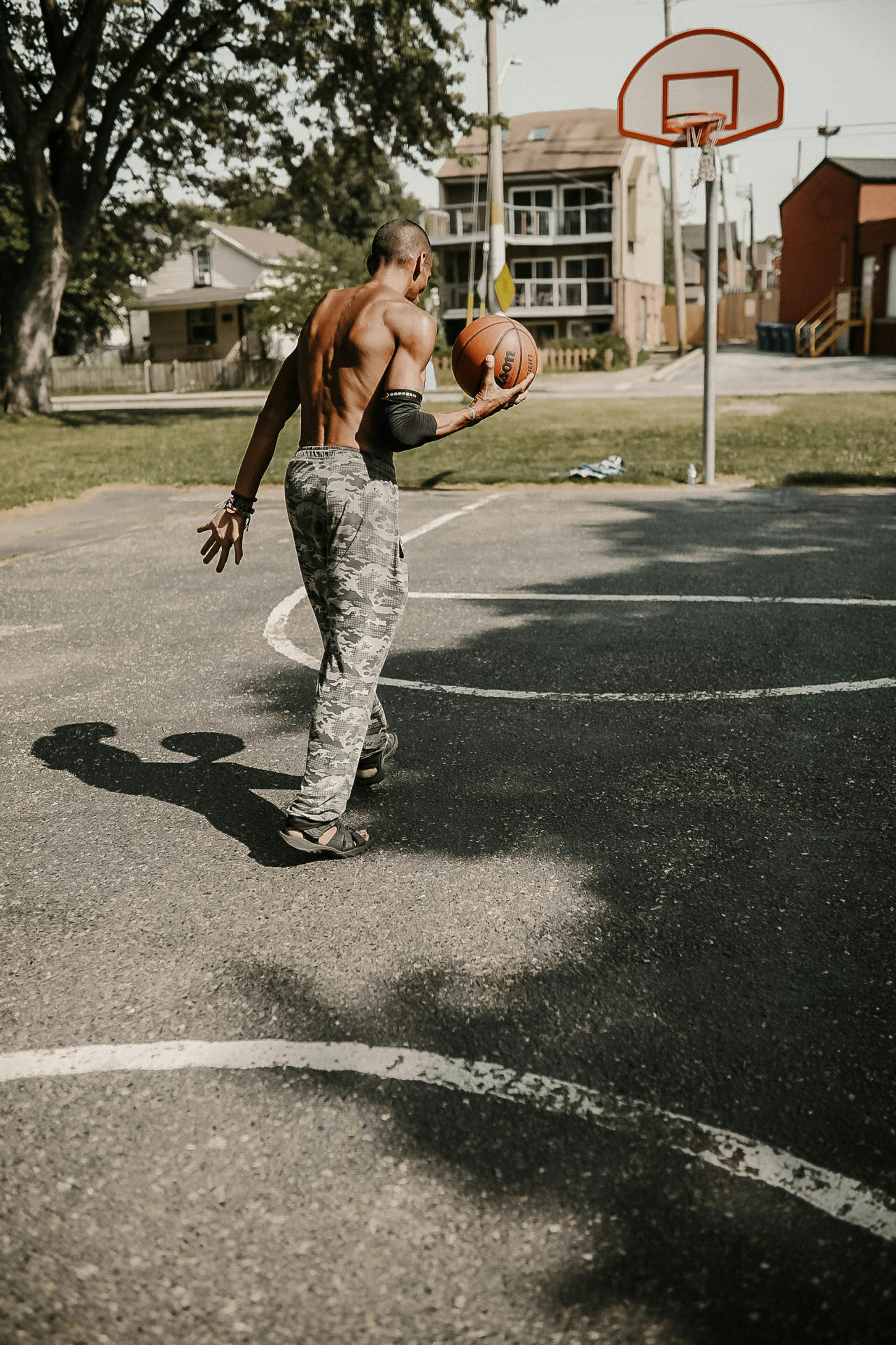 A Shirtless Man Playing Basketball · Free Stock Photo