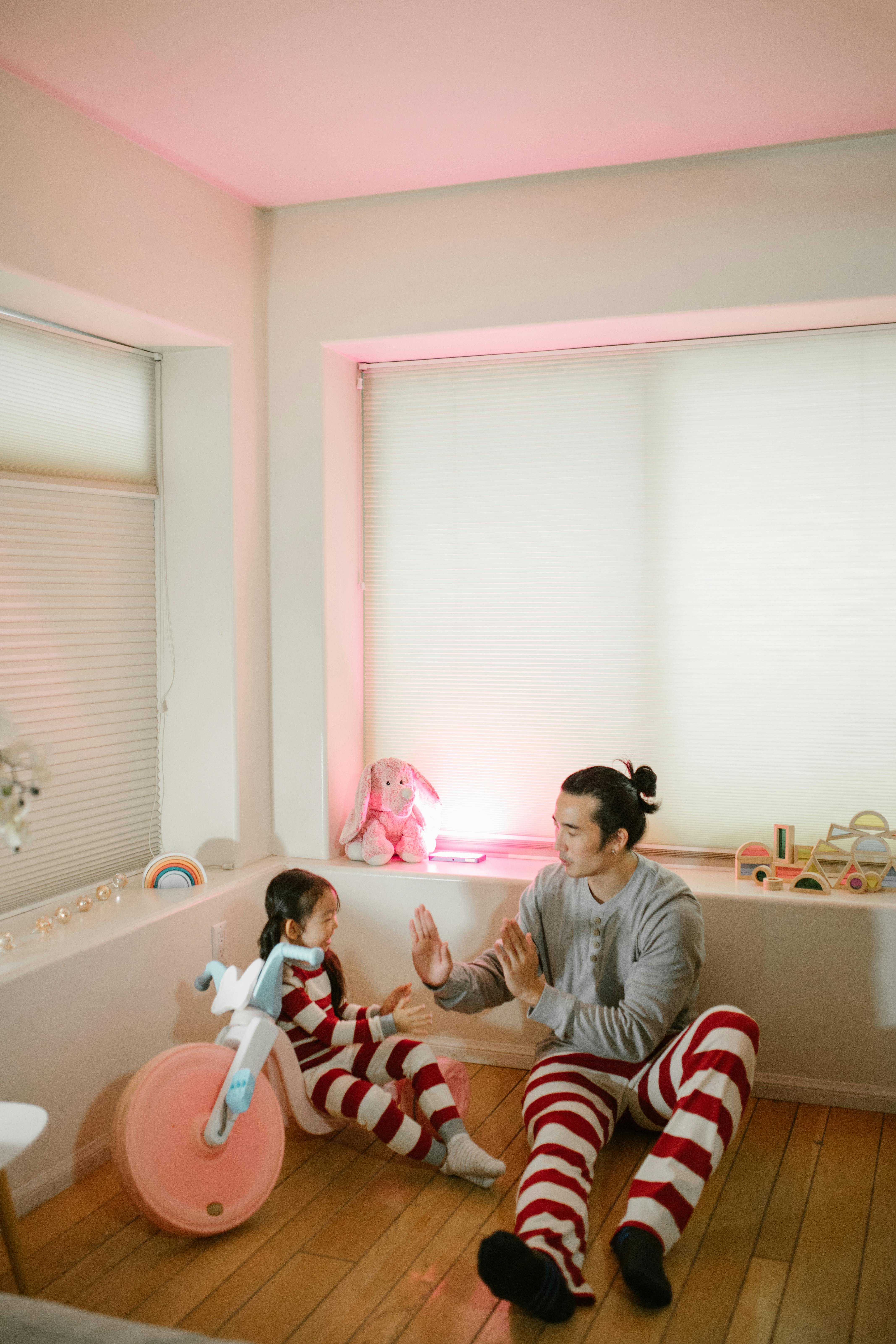 Father and Daughter Playing Clapping Game · Free Stock Photo