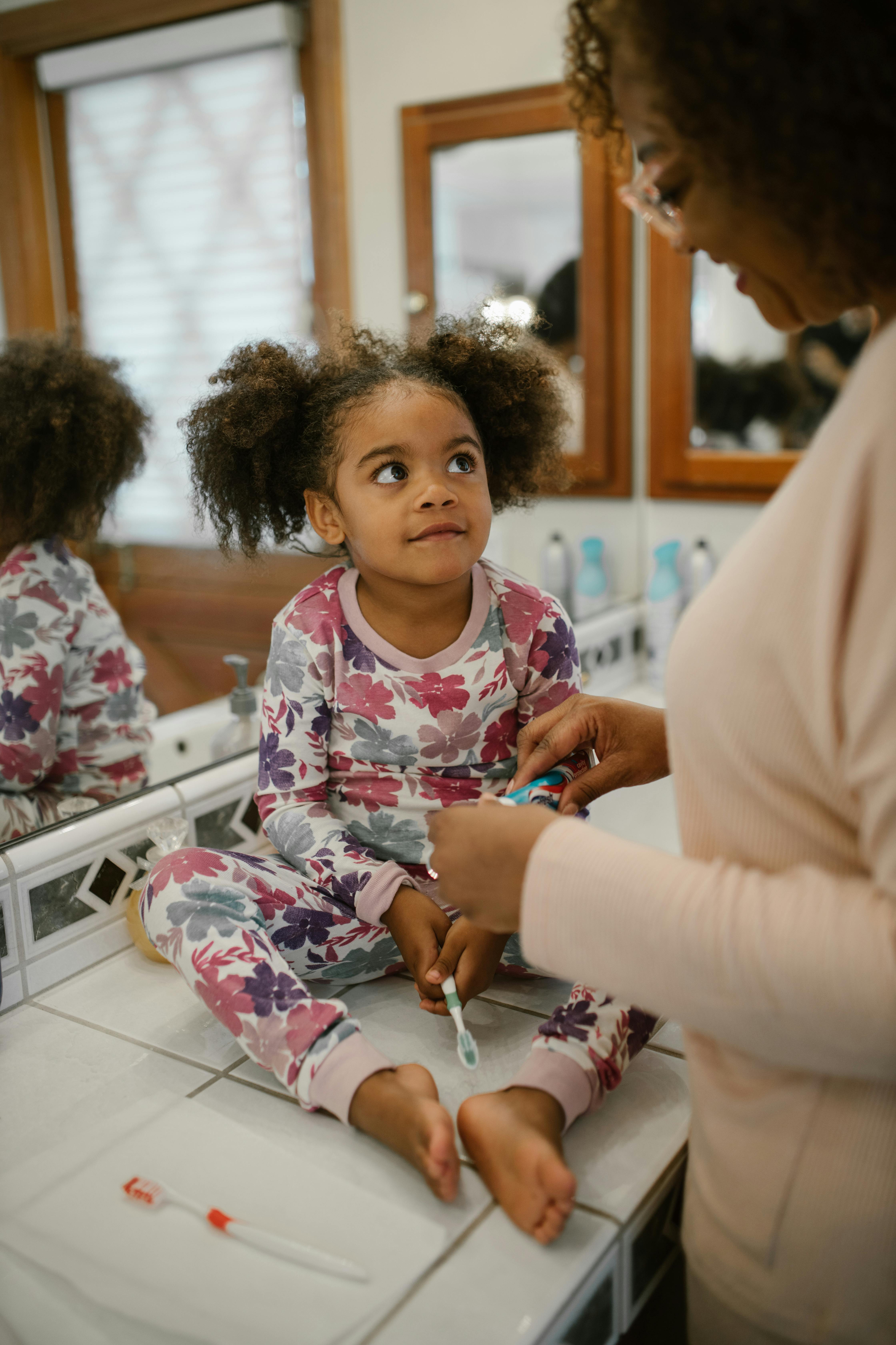 Mother and Daughter Dental Care · Free Stock Photo