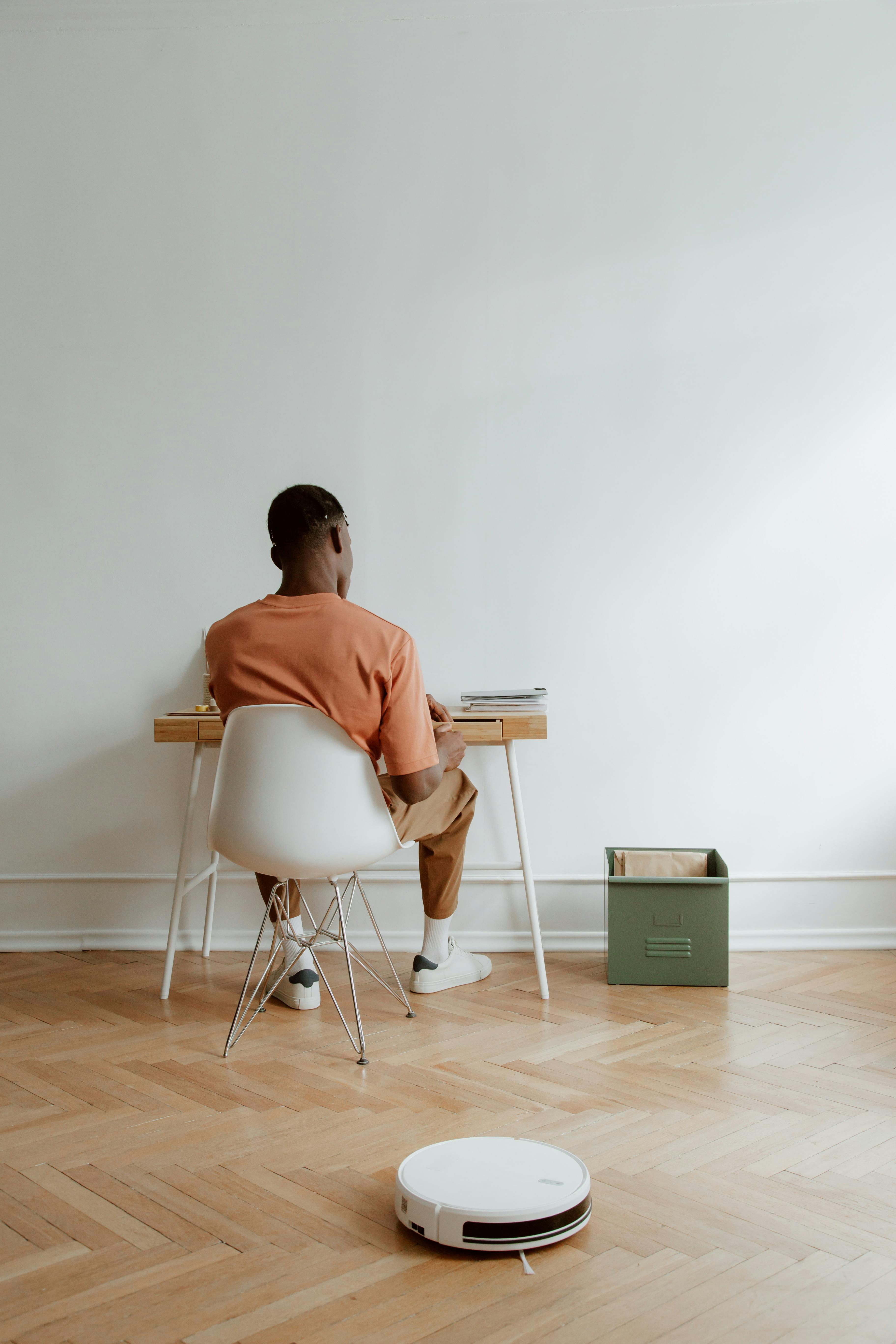 Desk Area and Cleaning Robot on Floor · Free Stock Photo
