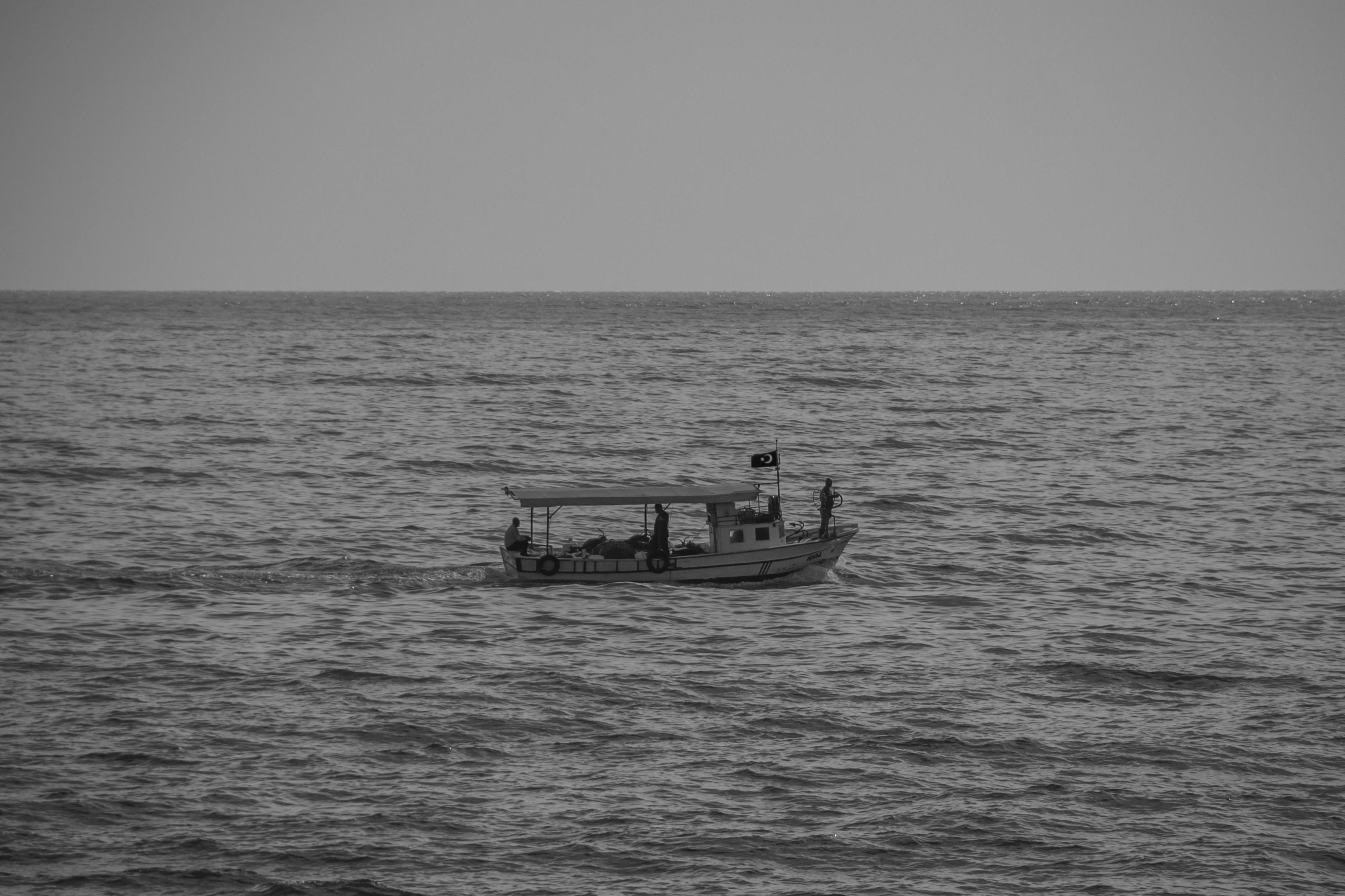 Grayscale Photo of Ships Cruising on Sea · Free Stock Photo