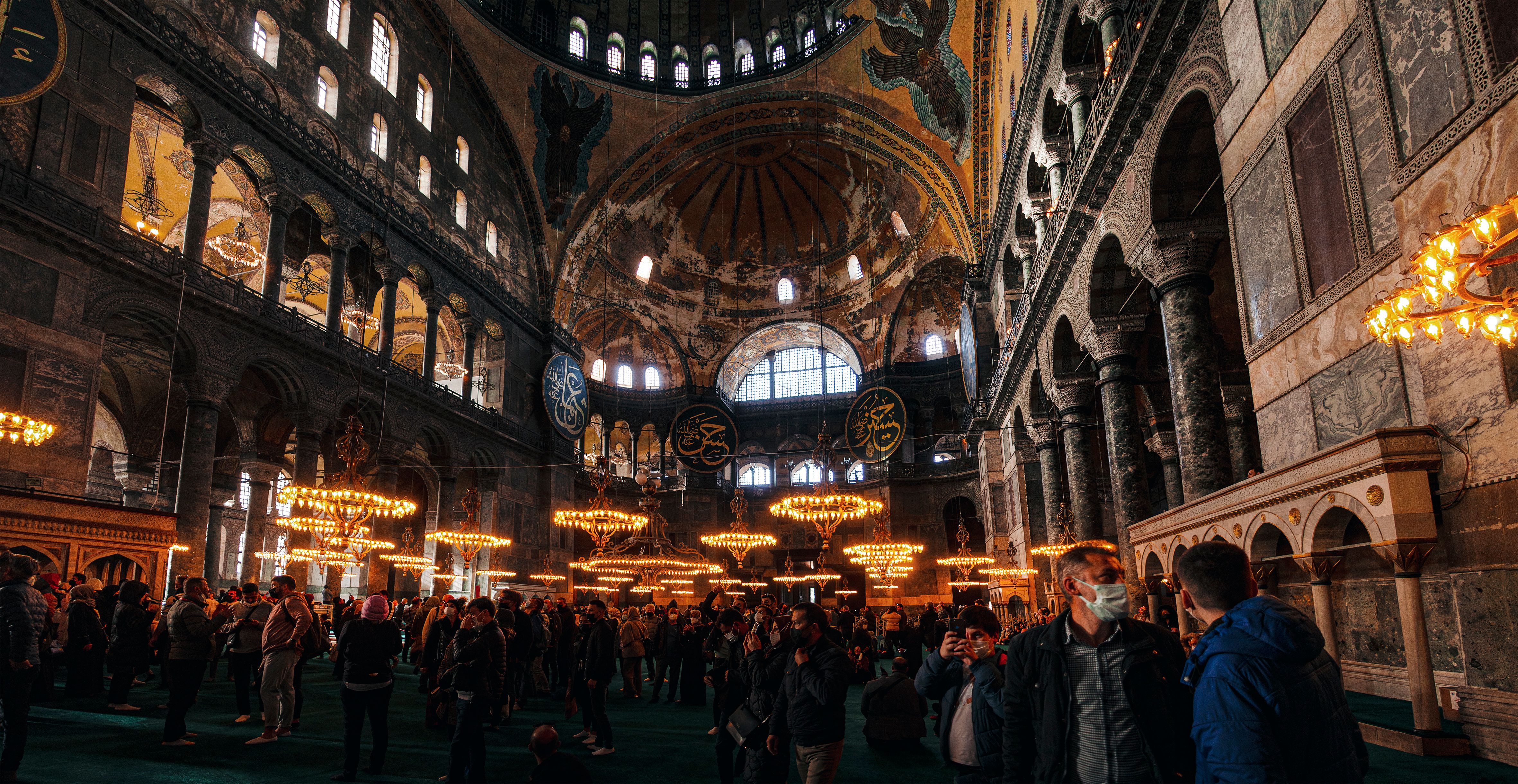 People Sitting and Praying in Mosque behind Peephole · Free Stock Photo