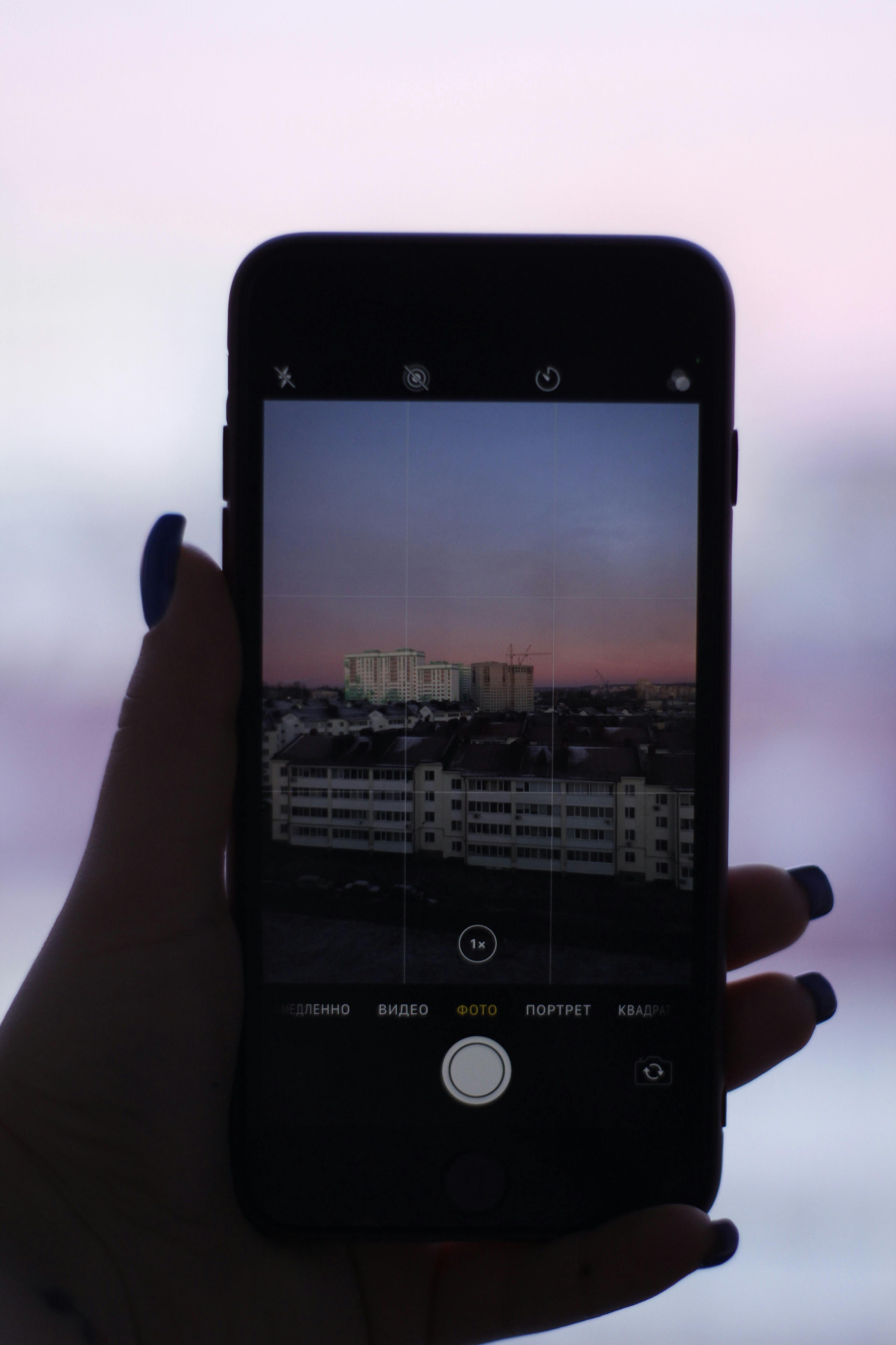 A Cellphone with Screenshot of Covid Certificate on a Yellow Surface ...