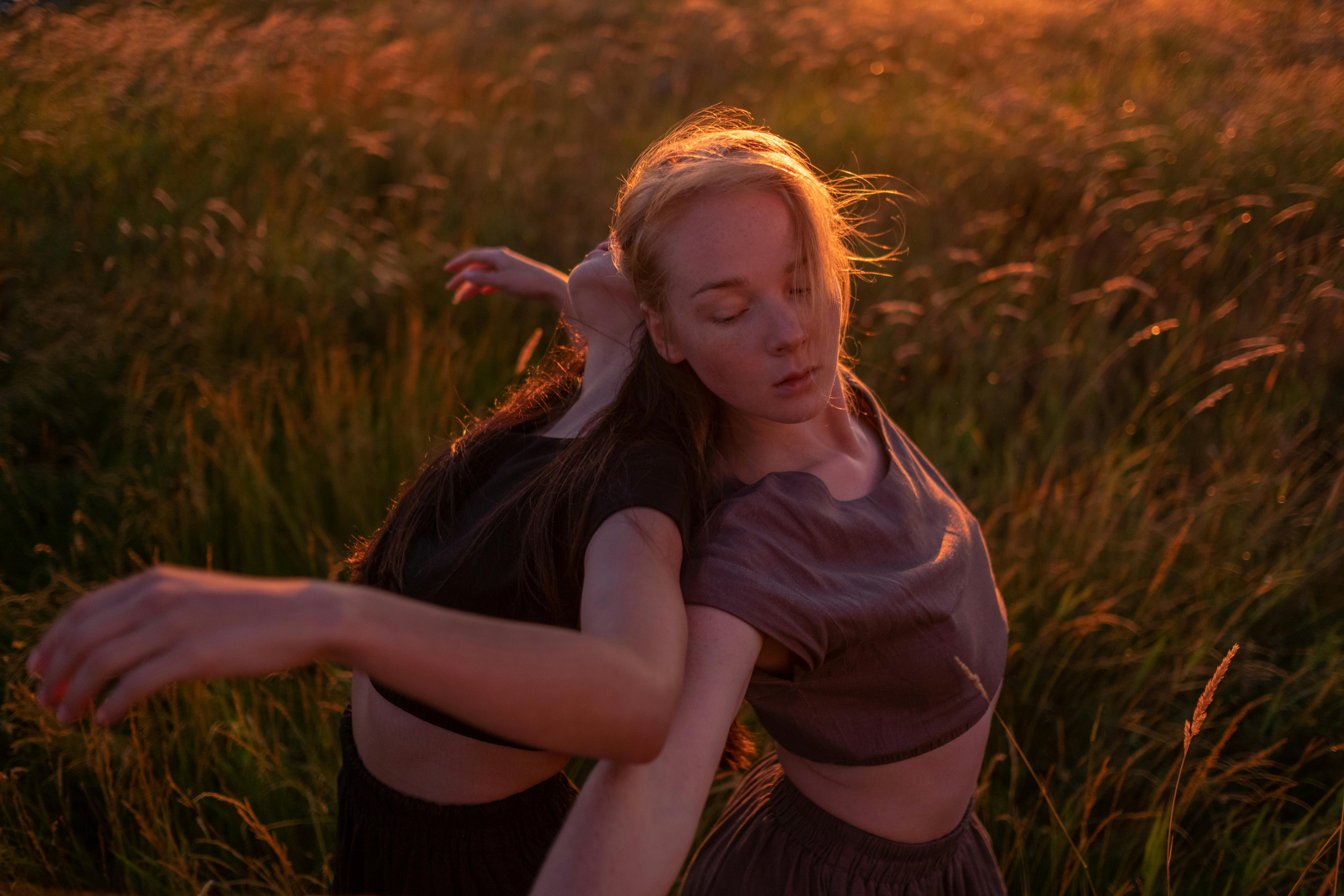 Women Doing Contemporary Dance while Leaning Back to Back · Free Stock ...