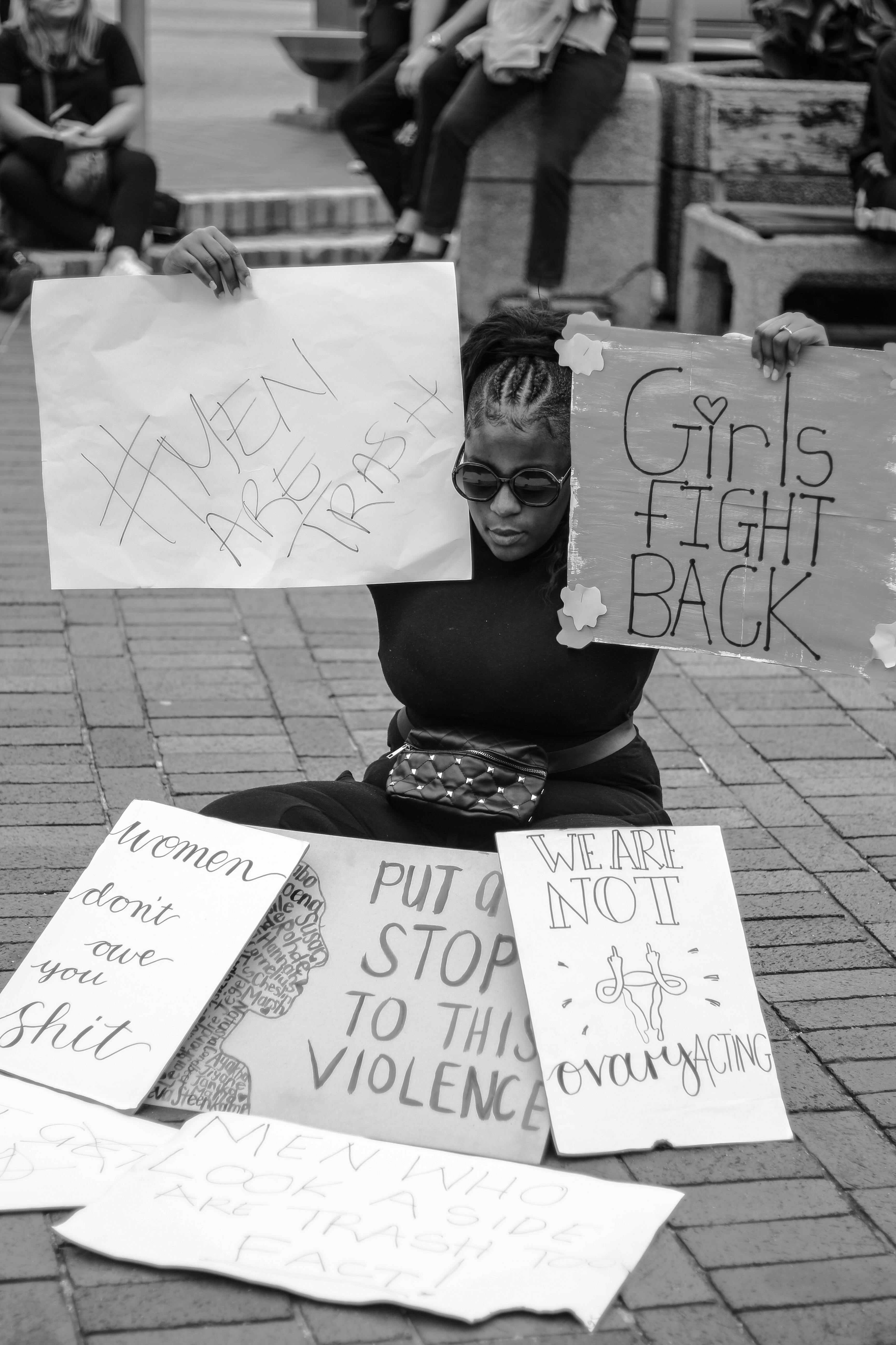 People Sitting Writing Protest Slogans on Cardboard Banners · Free ...