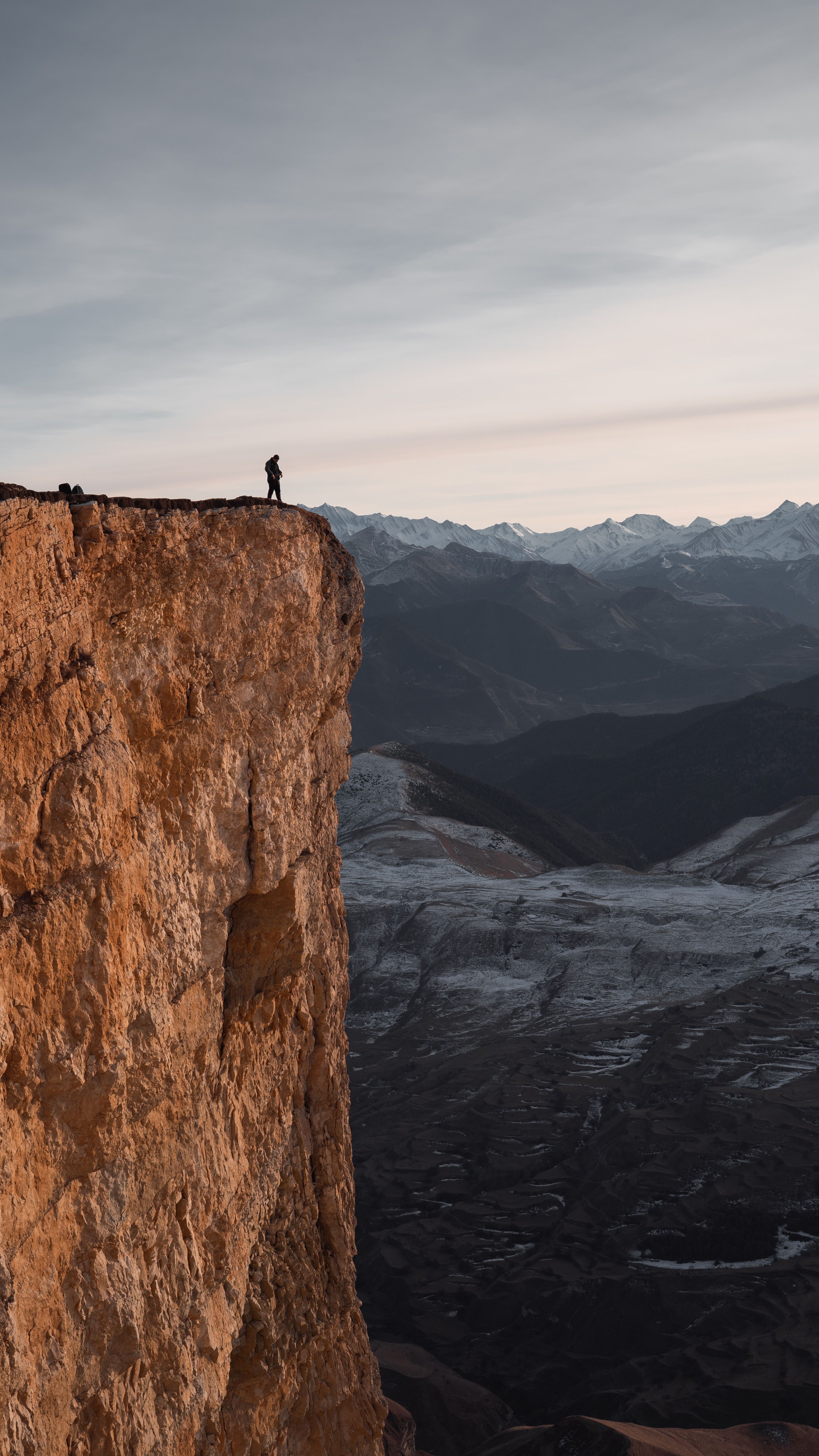 A Person Standing on a Cliff · Free Stock Photo