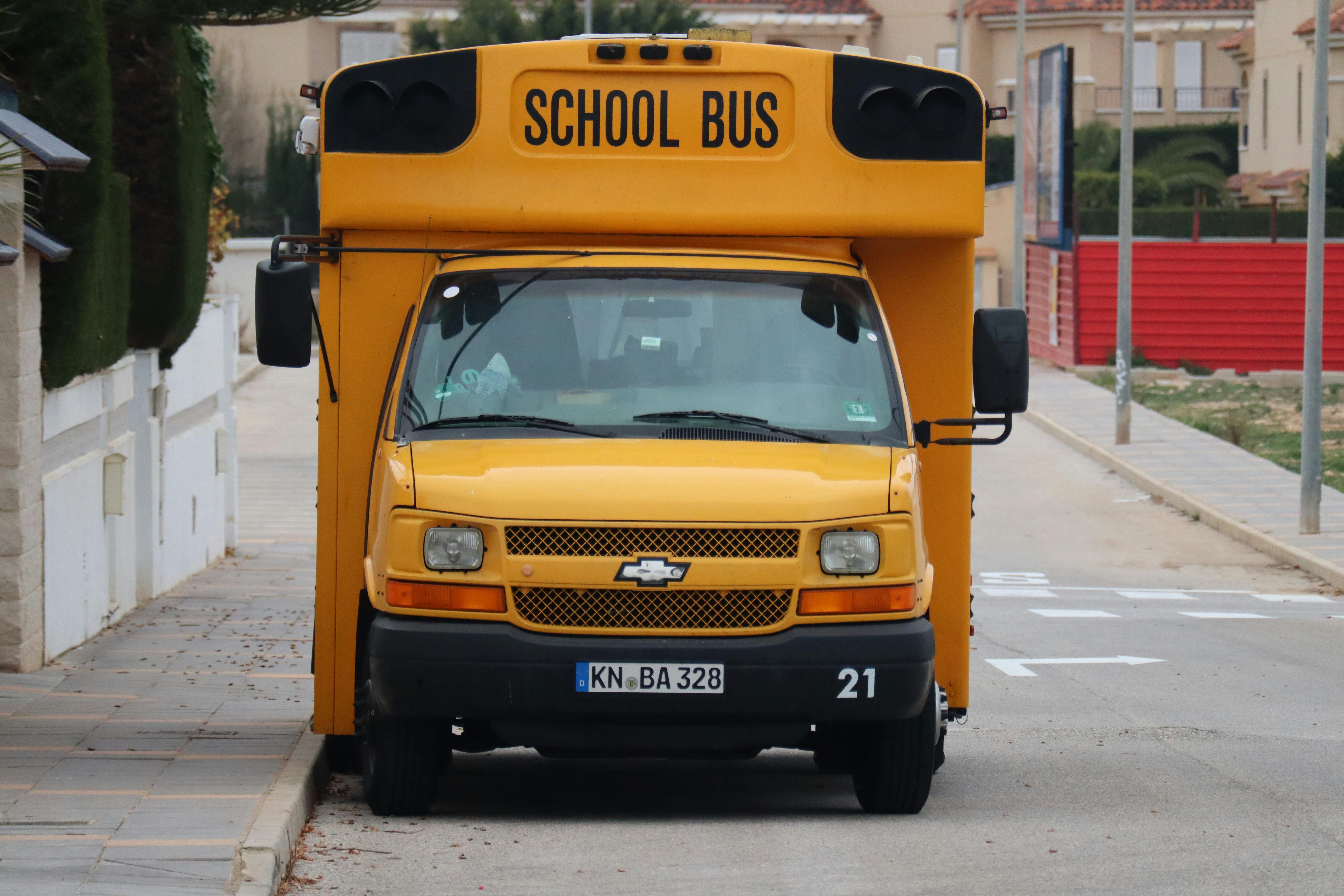 Yellow School Bus Parked on Side of the Road · Free Stock Photo