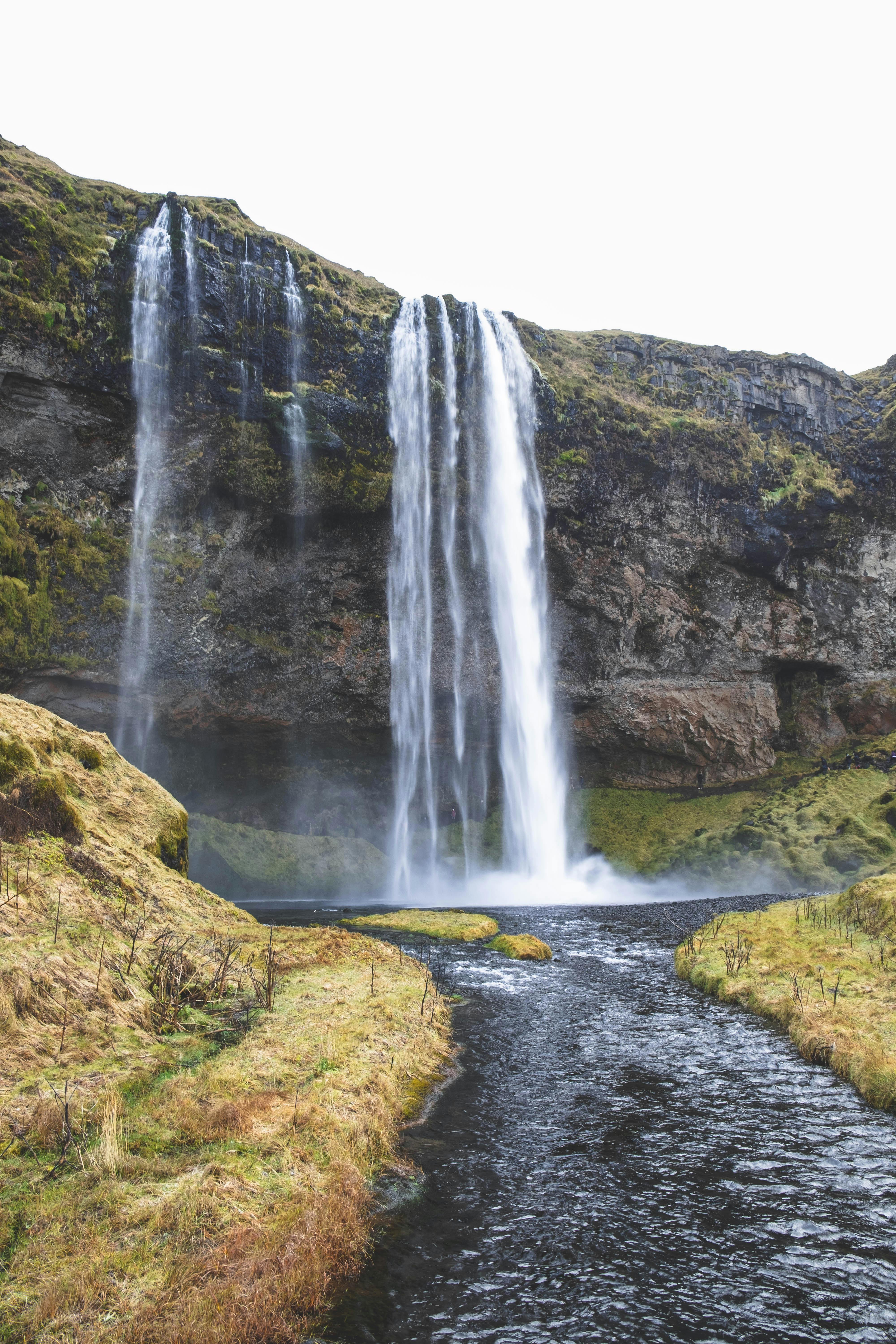 Photo of Waterfall Between Mountain · Free Stock Photo