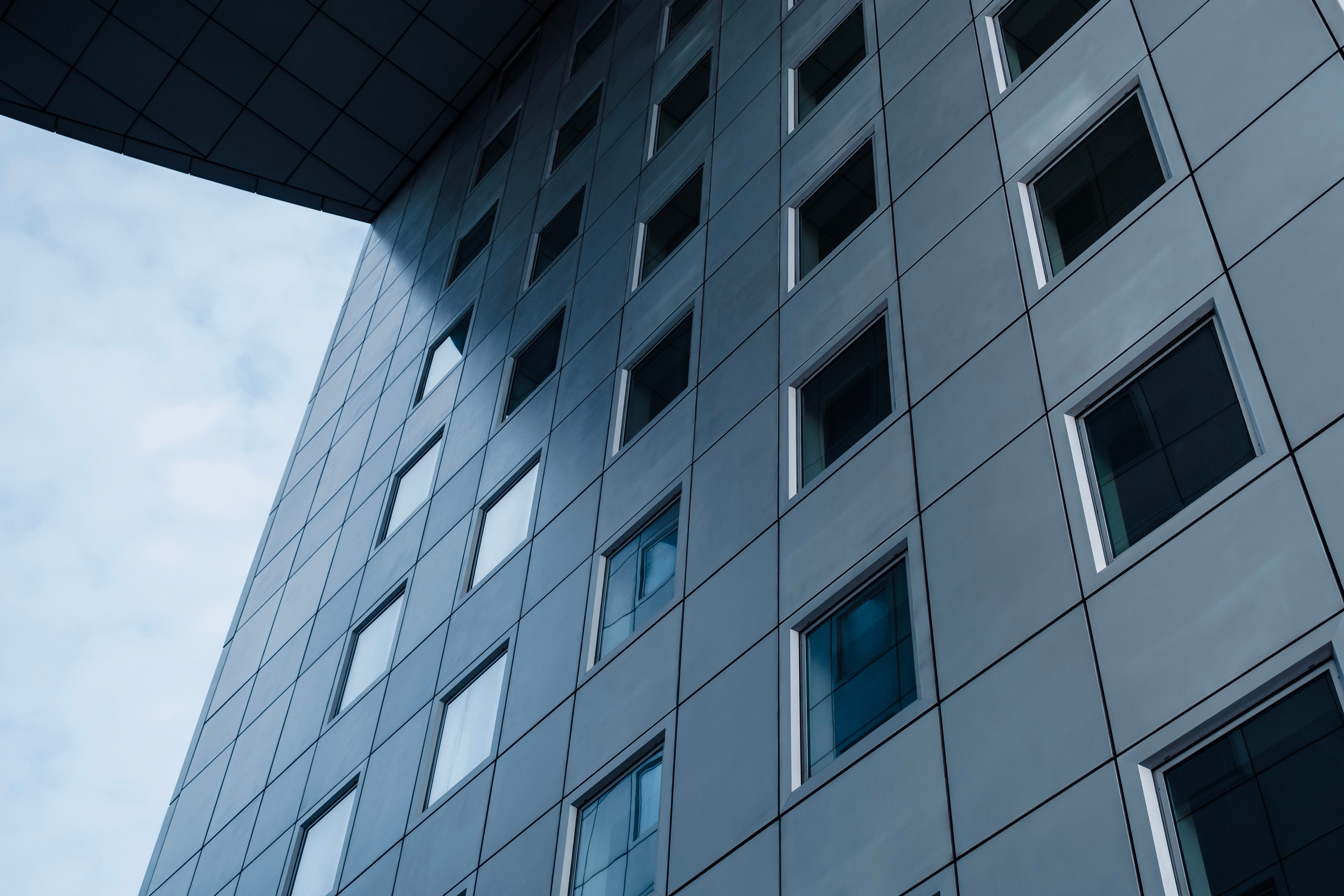 Gray Concrete Building in Low Angle Shot · Free Stock Photo