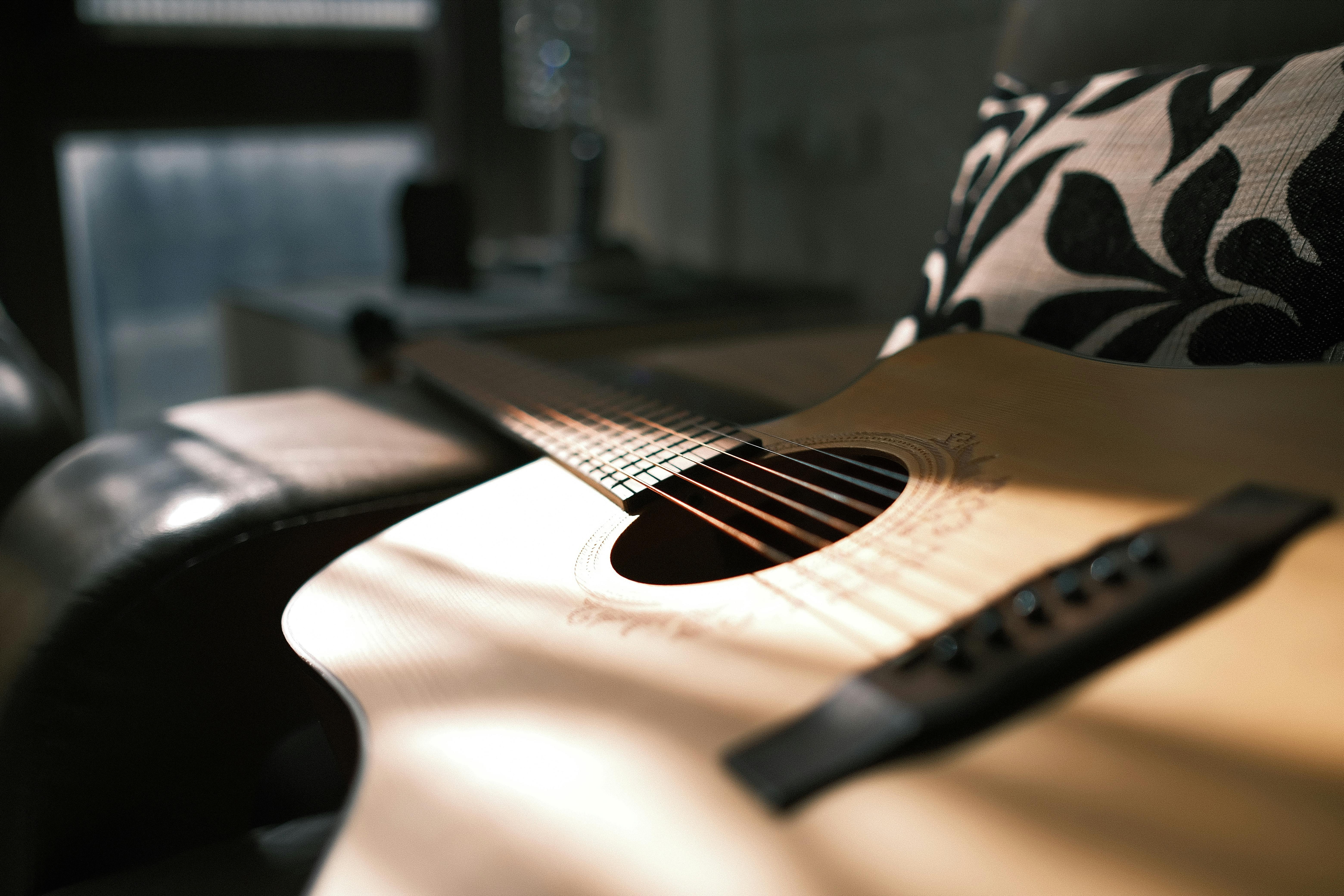 Close-Up Shot of an Acoustic Guitar · Free Stock Photo